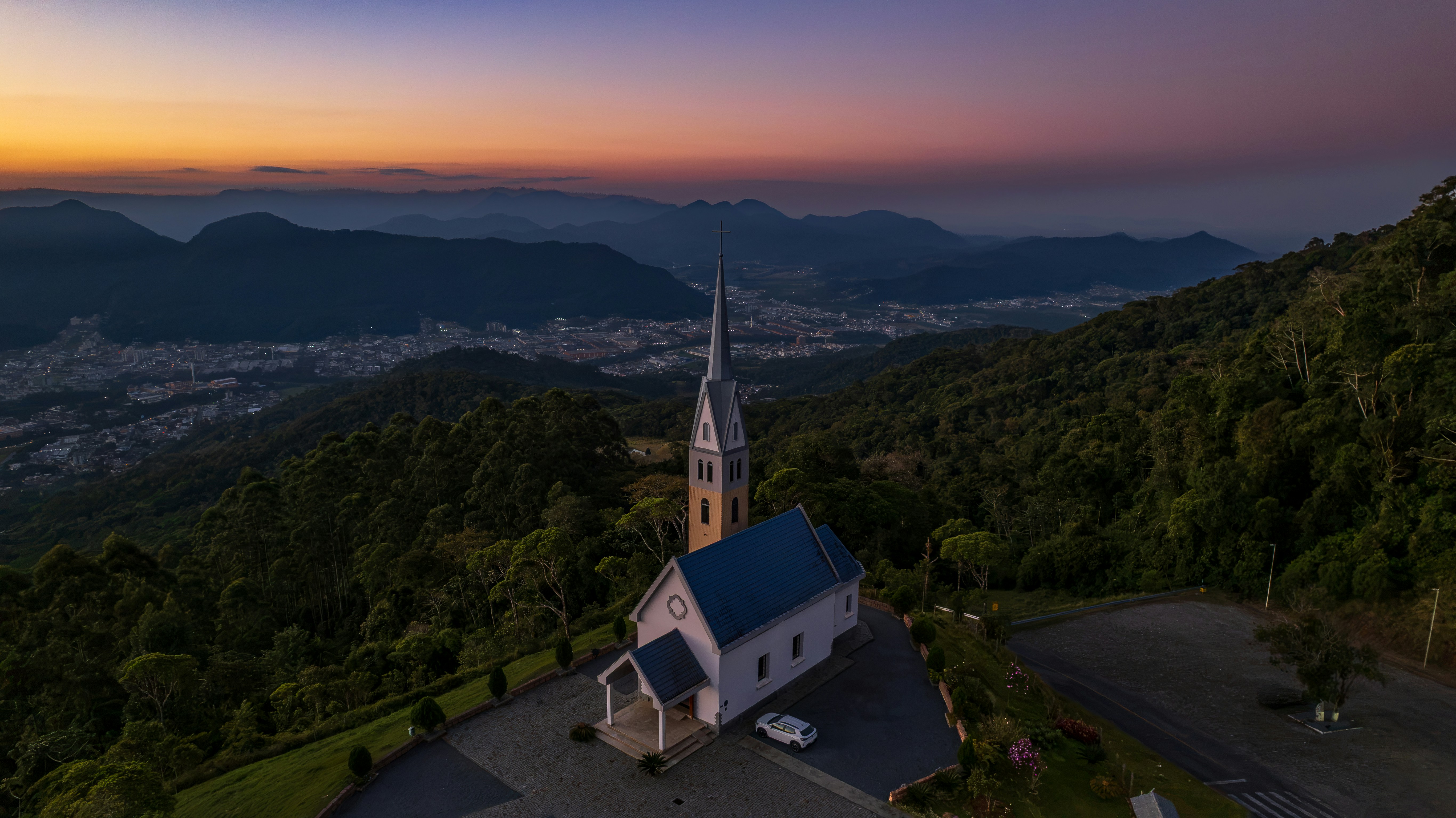 Hilltop Church at Sunset Over a Valley of Rolling Green