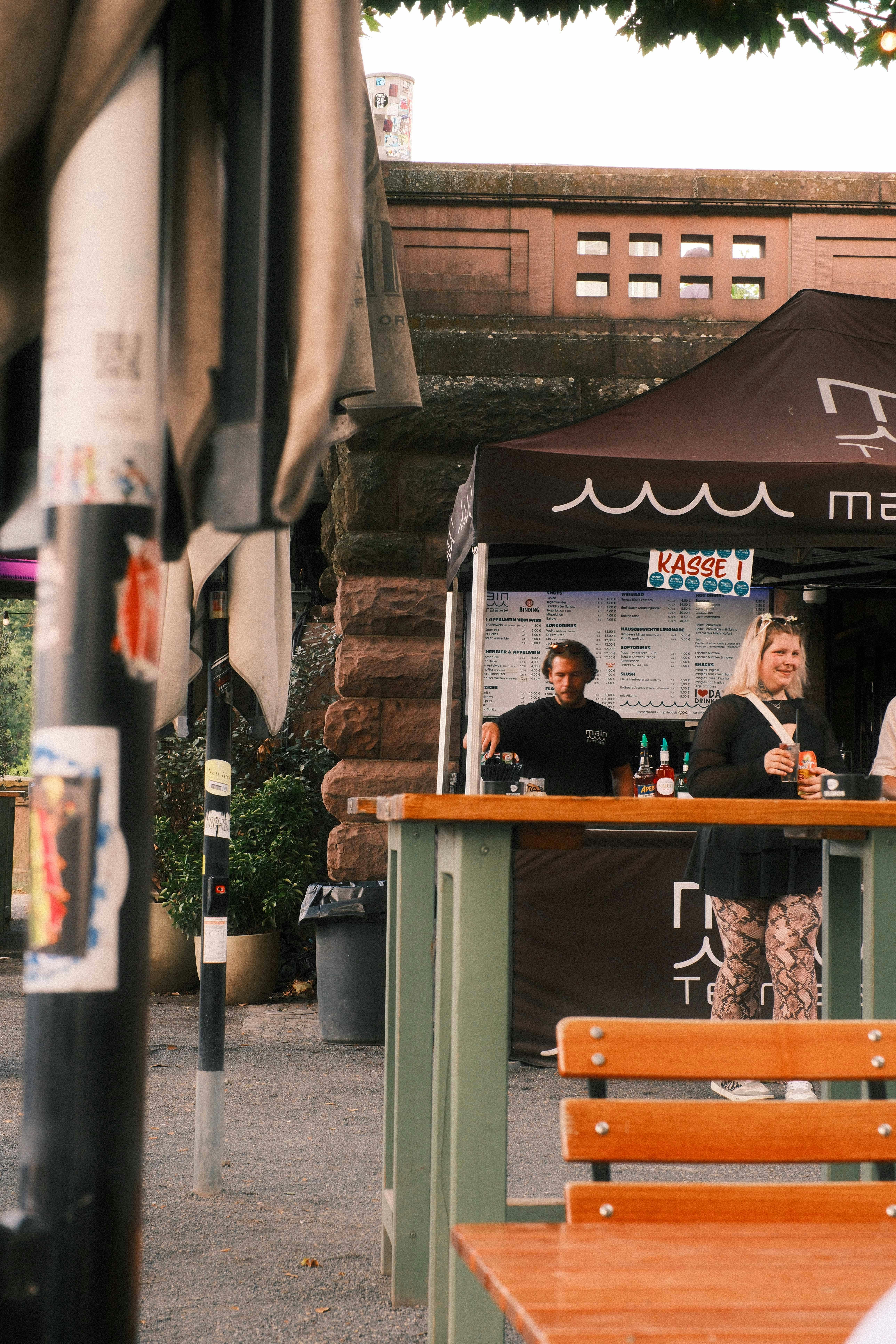 Bar Stall Beneath a Tent: The Courtyard Portrait