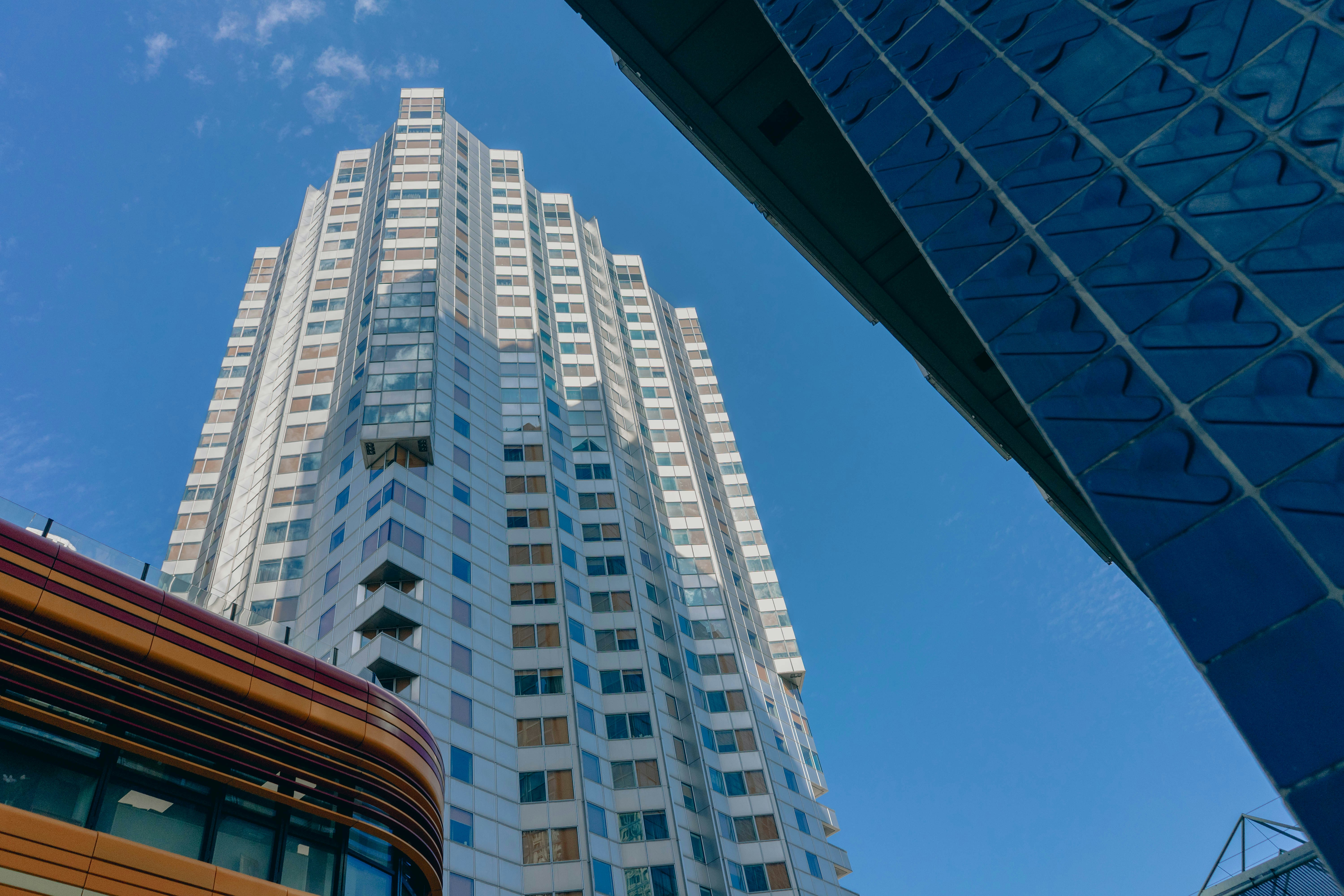 Towering Facade: Geometry Meets Sky in Urban Architecture