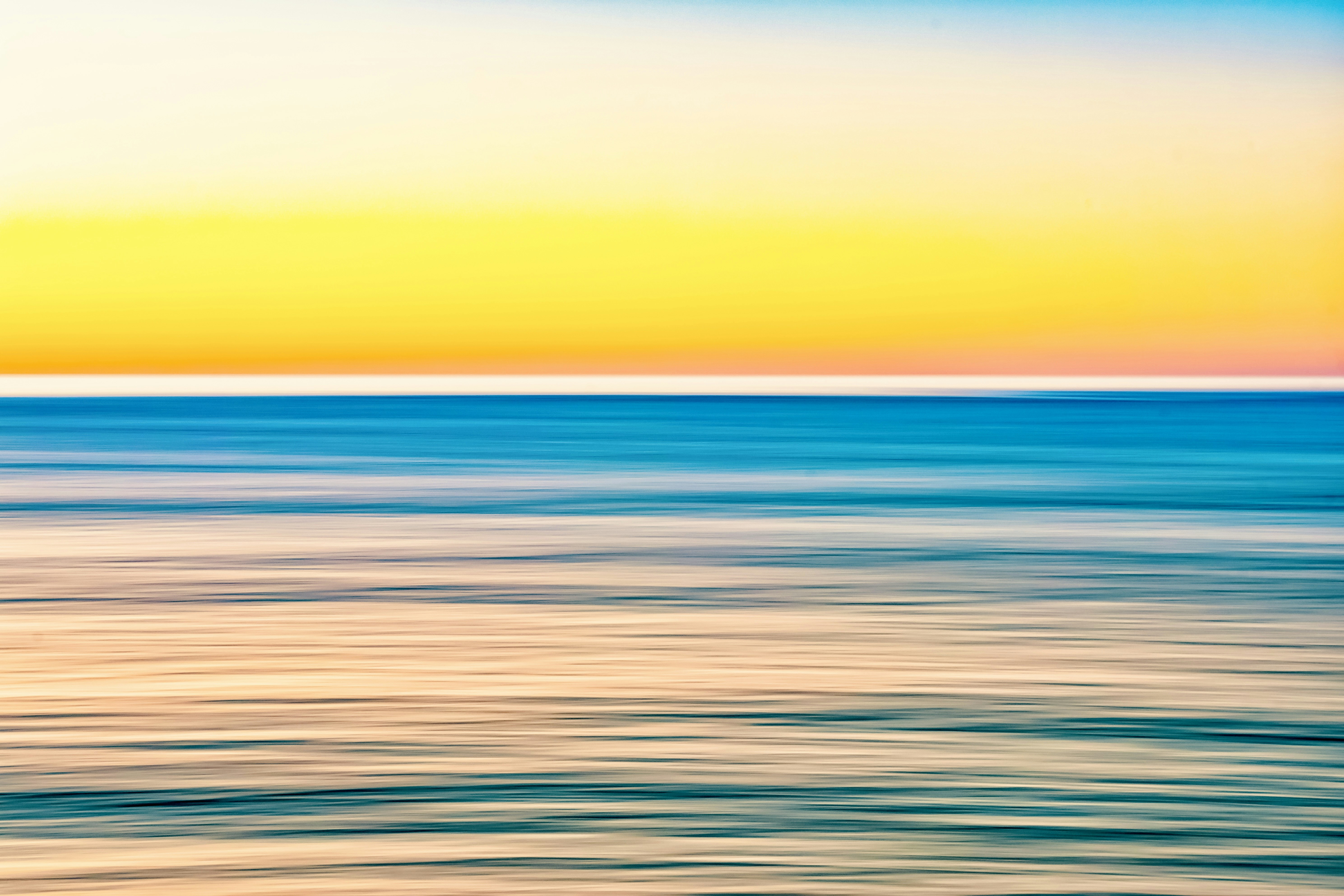 Sunset Strata Over Quiet Ocean