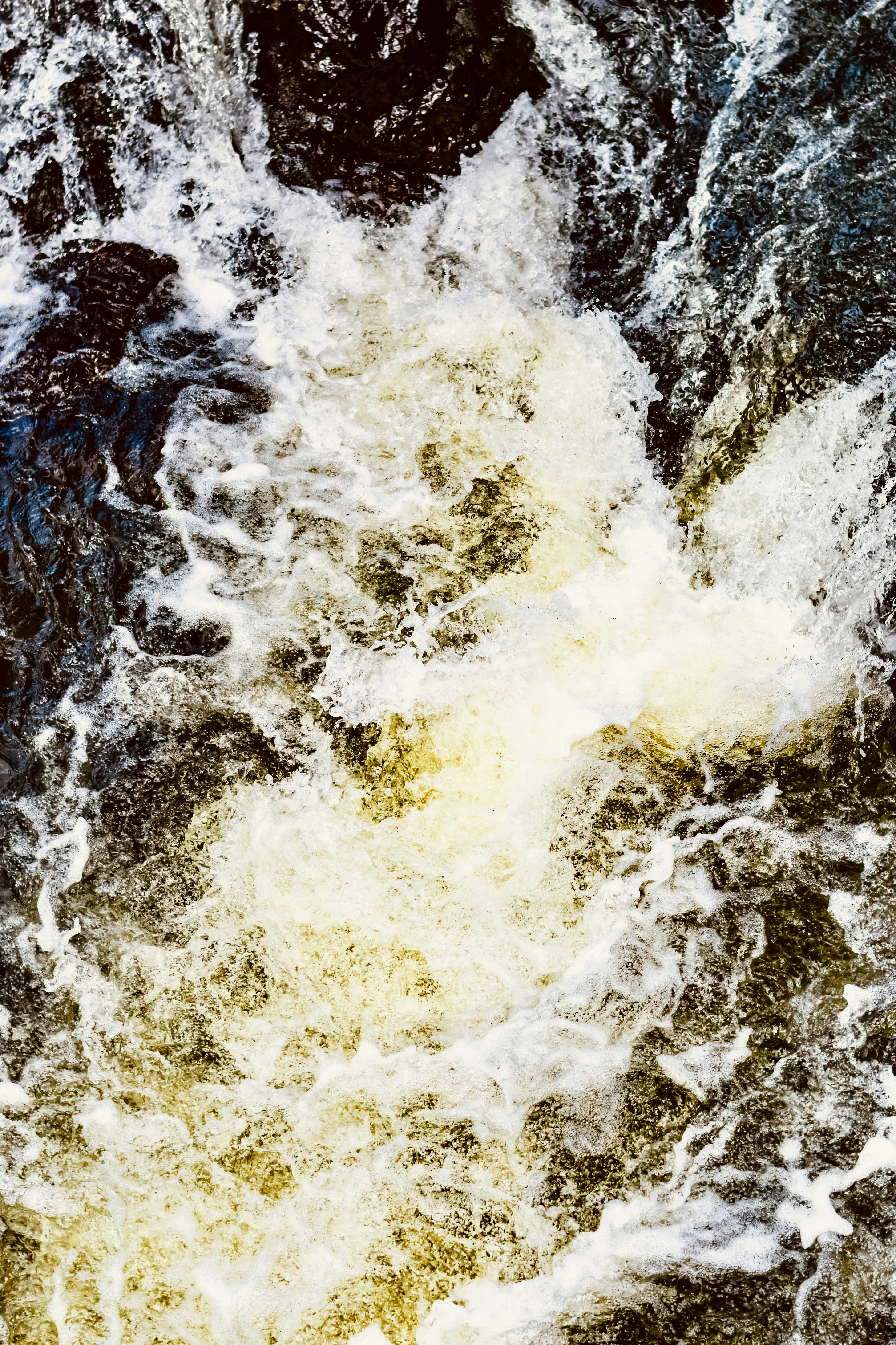 Cascade of Light and Foam: A Turbulent Close-Up