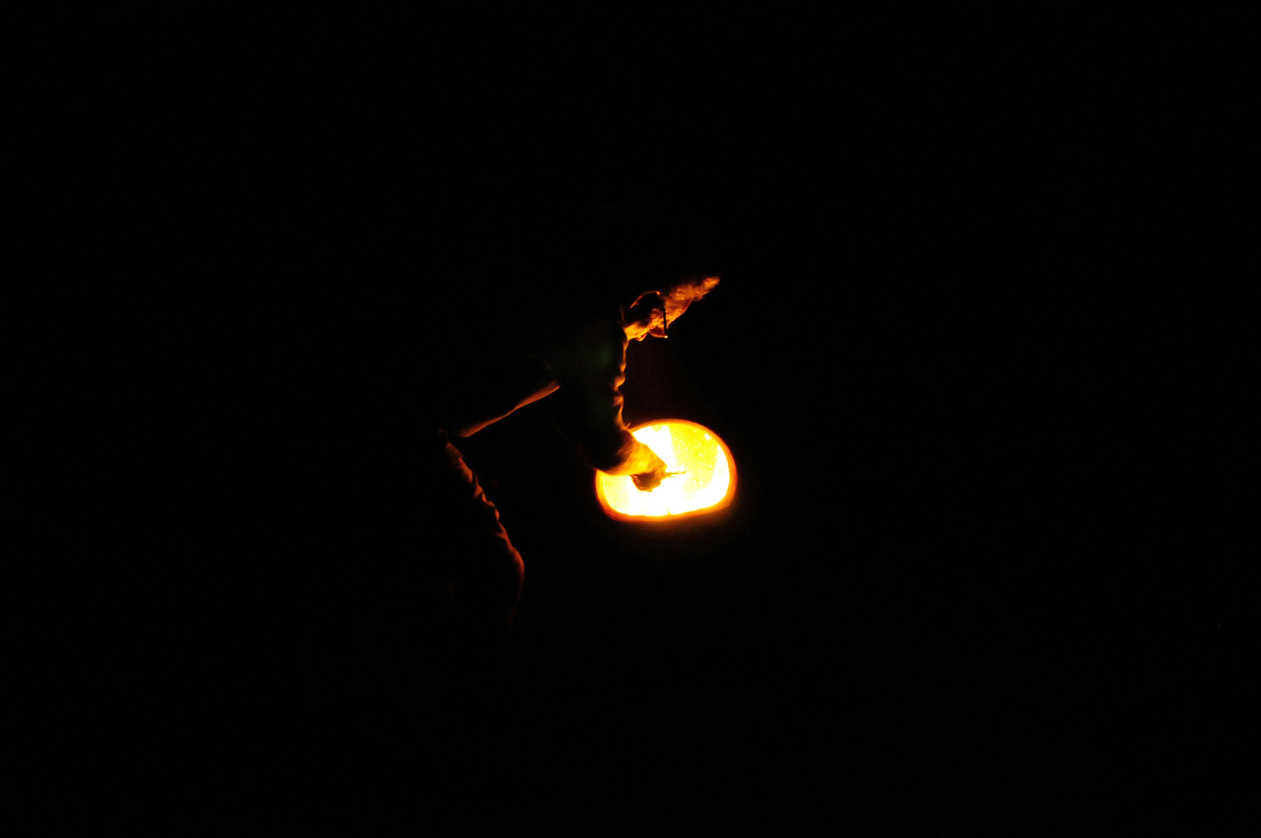 Glowing ember against the void: a lone spark in darkness
