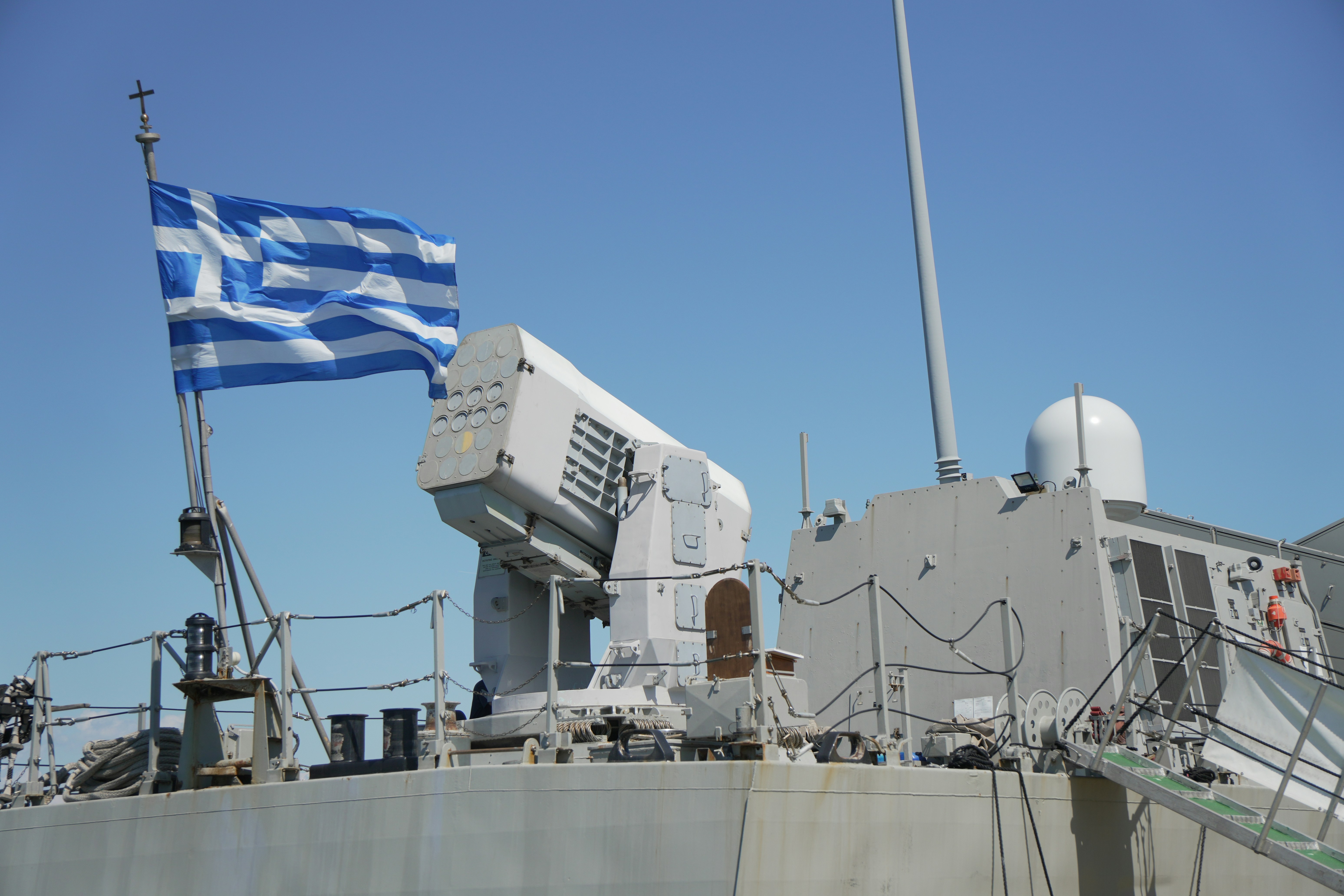 Greek Flag Above a Warship: Quiet Maritime Sentinel