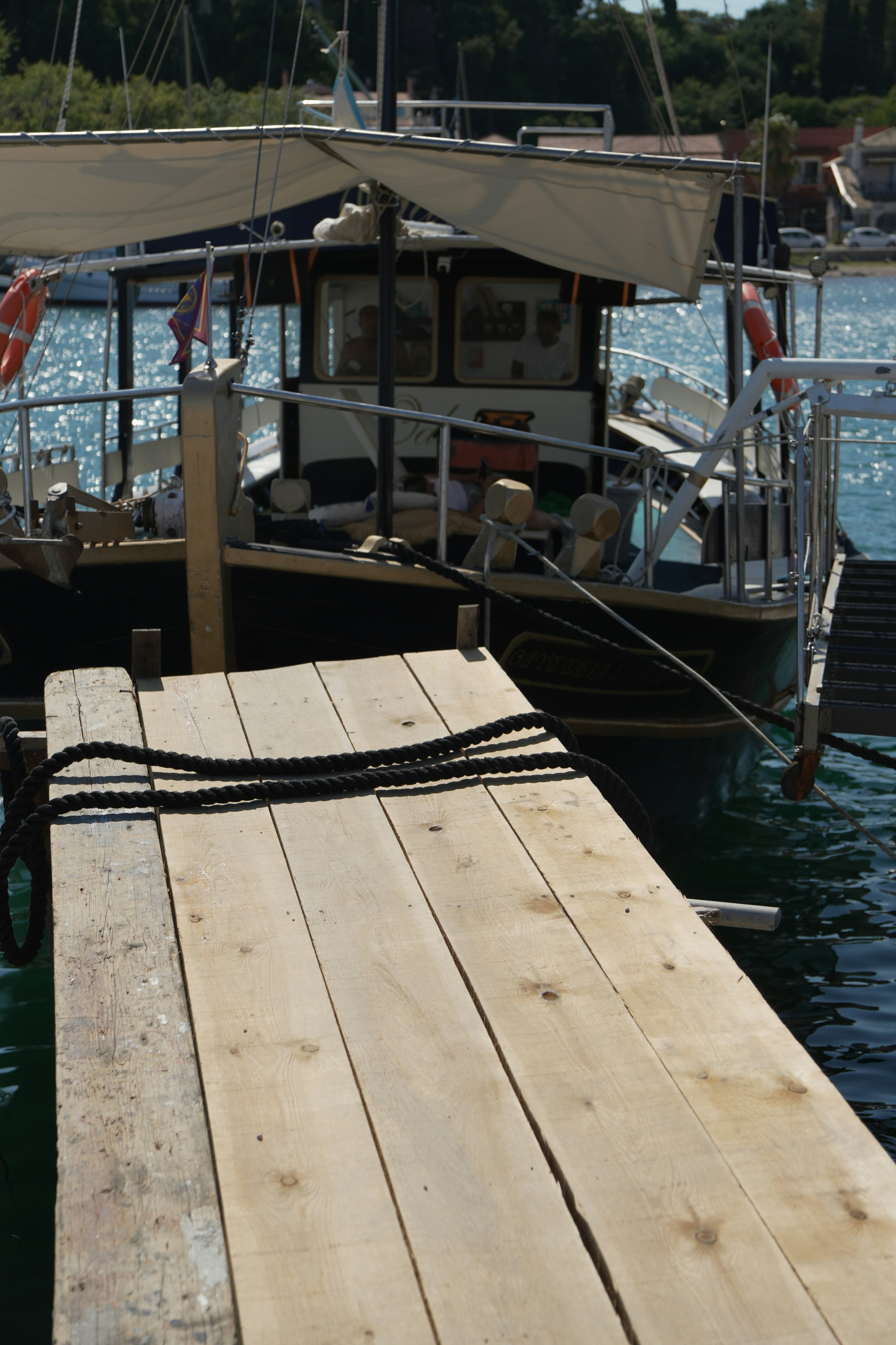Weathered Dock: A Wooden Path Leads to a Quiet Boat