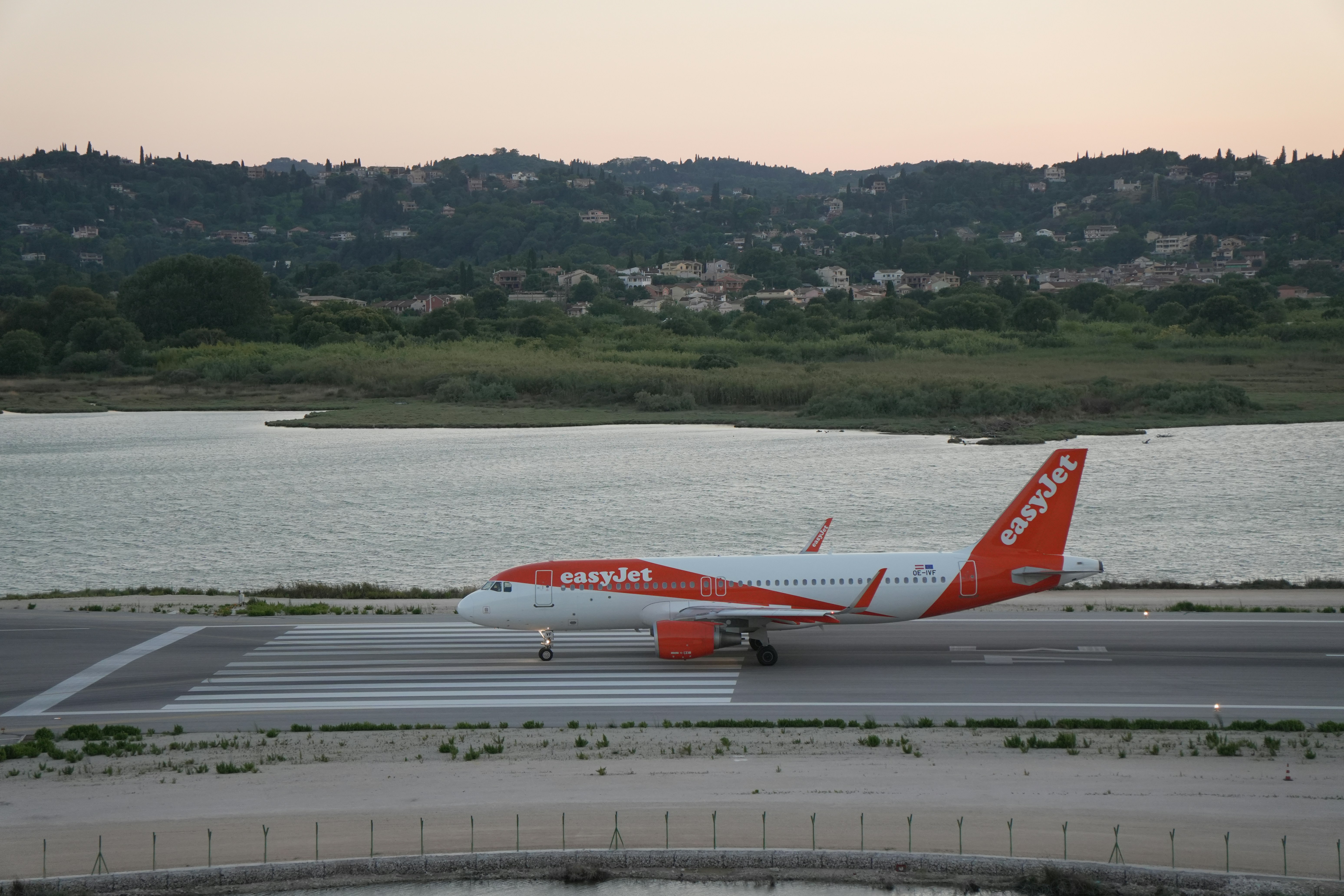 Red-and-White EasyJet: A Calm Taxi on a Coastal Runway