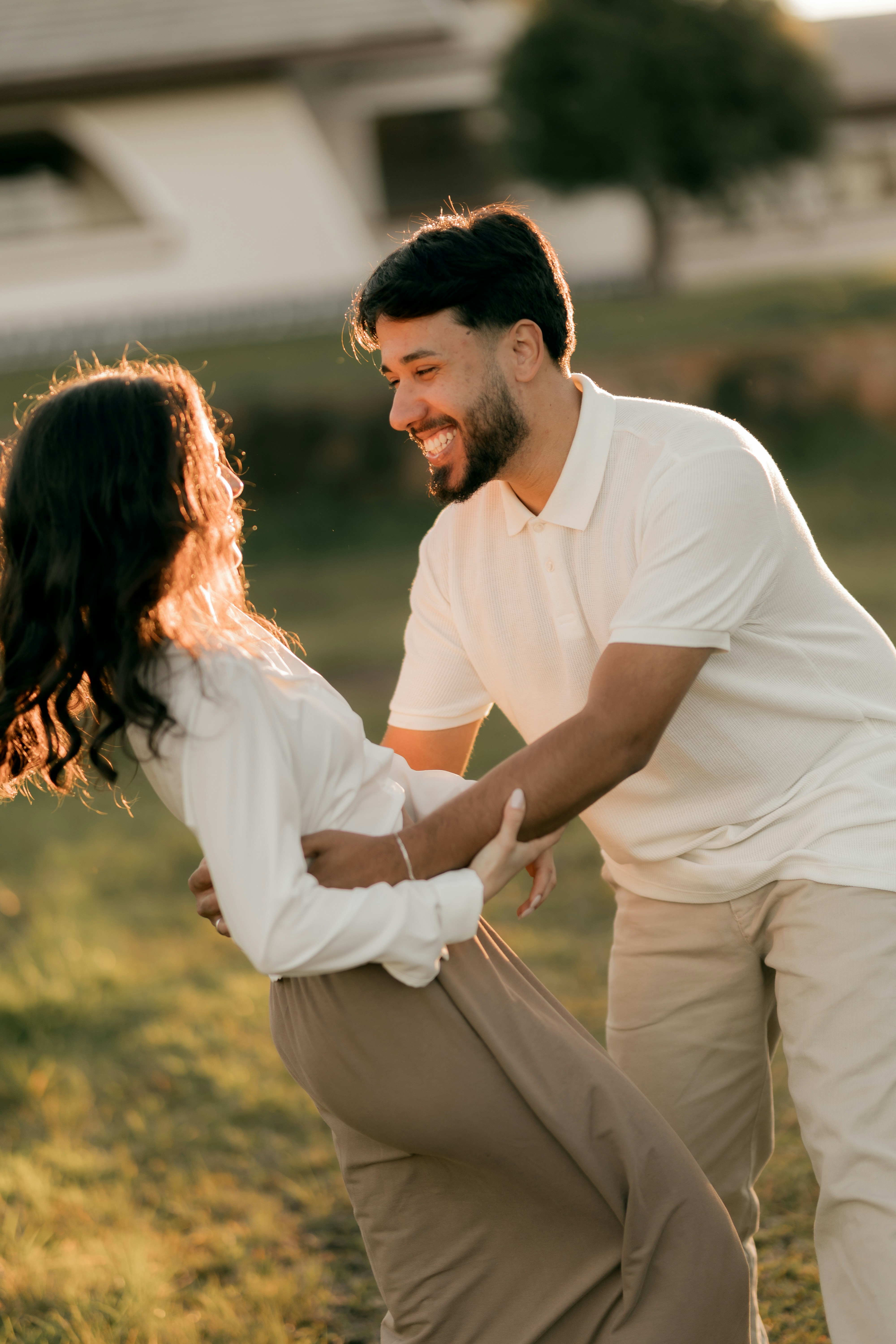 Joyful Duo in Golden Hour: A Playful Embrace