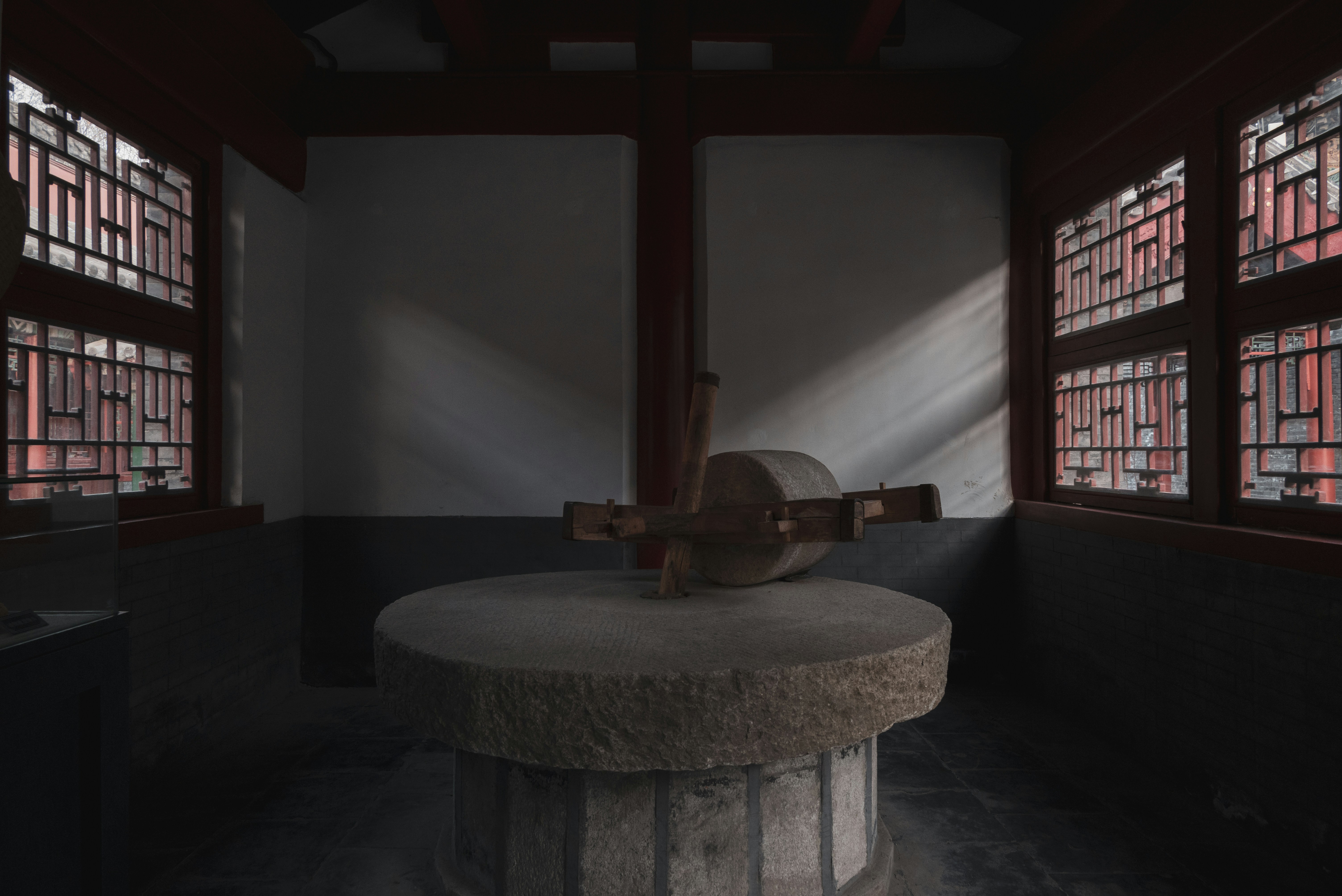 Stone Mill at Rest: A Quiet Chamber with Light Streaks