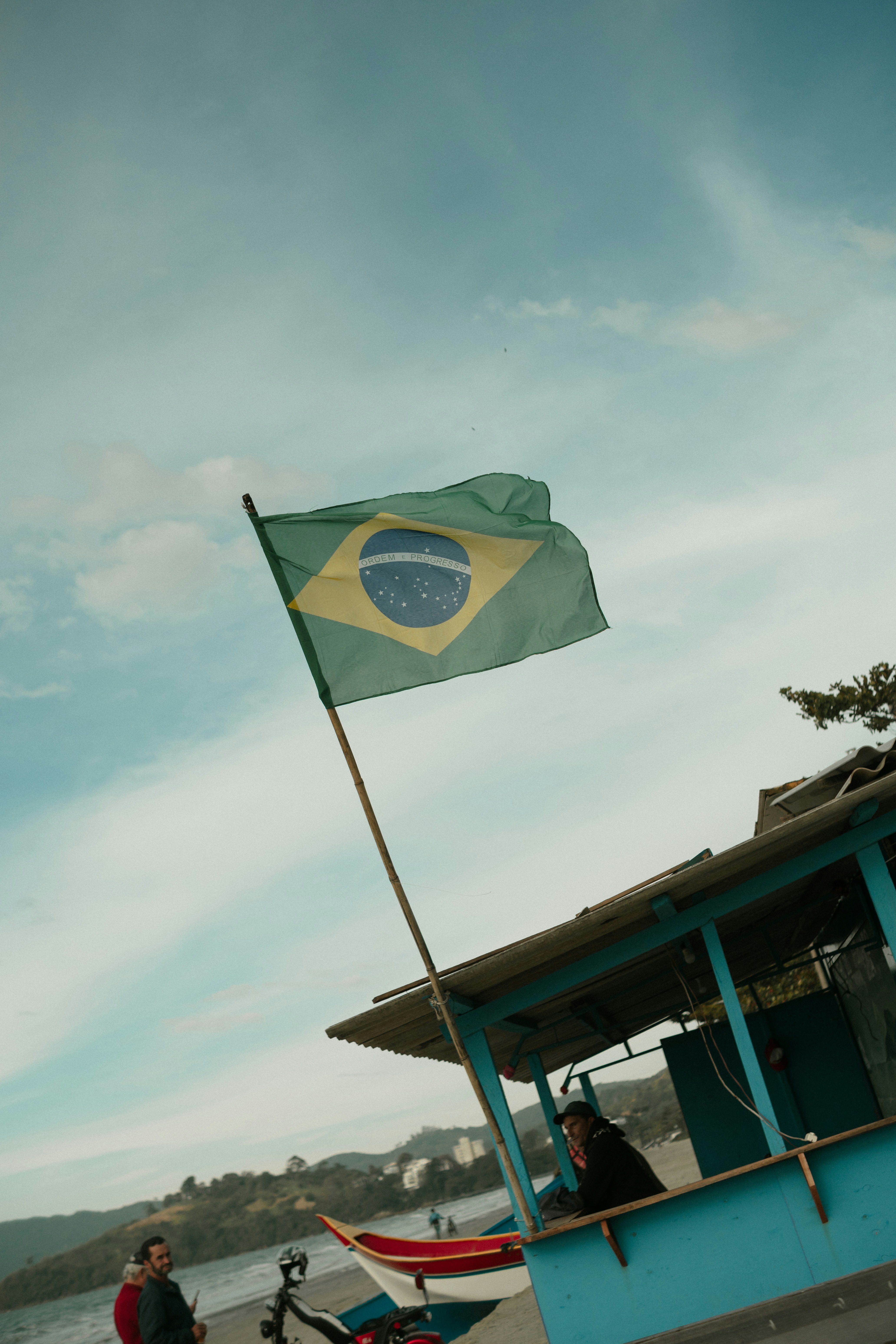 Brazilian Flag Over a Coastal Boat Dock