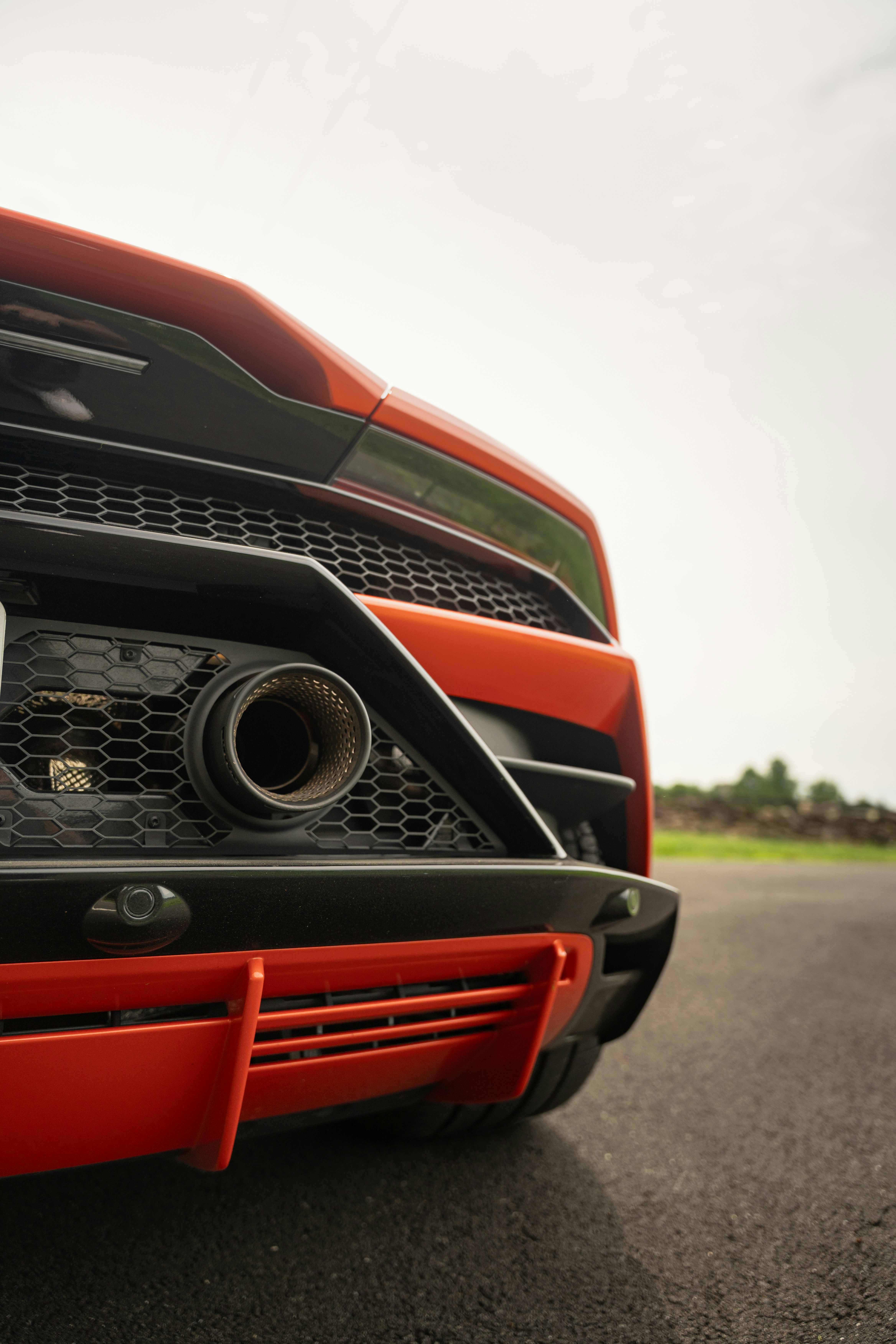 Front-angled Power: The Red Predator’s Grill and Exhaust