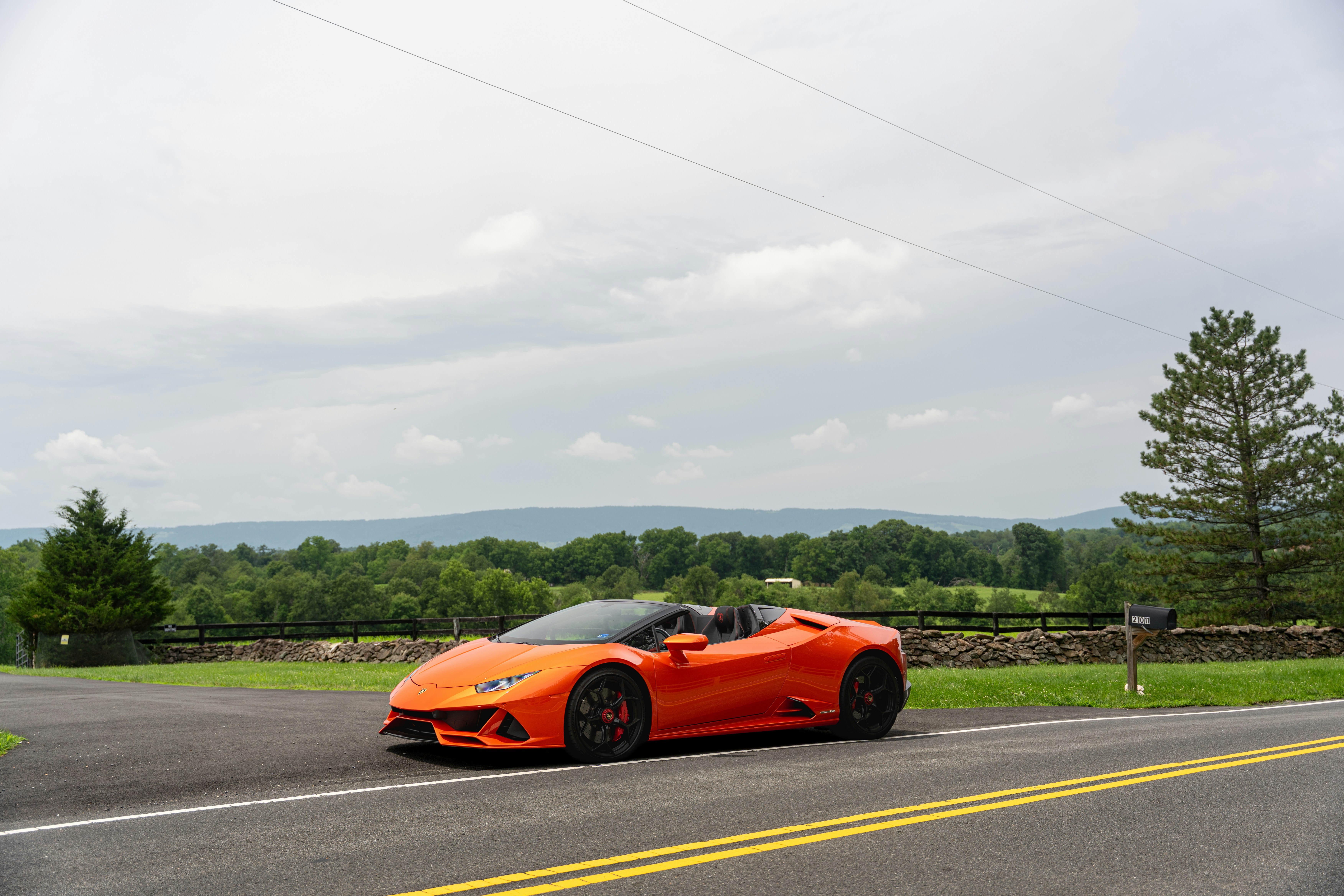 Orange thunder: a mid‑air‑low ride on a quiet country road