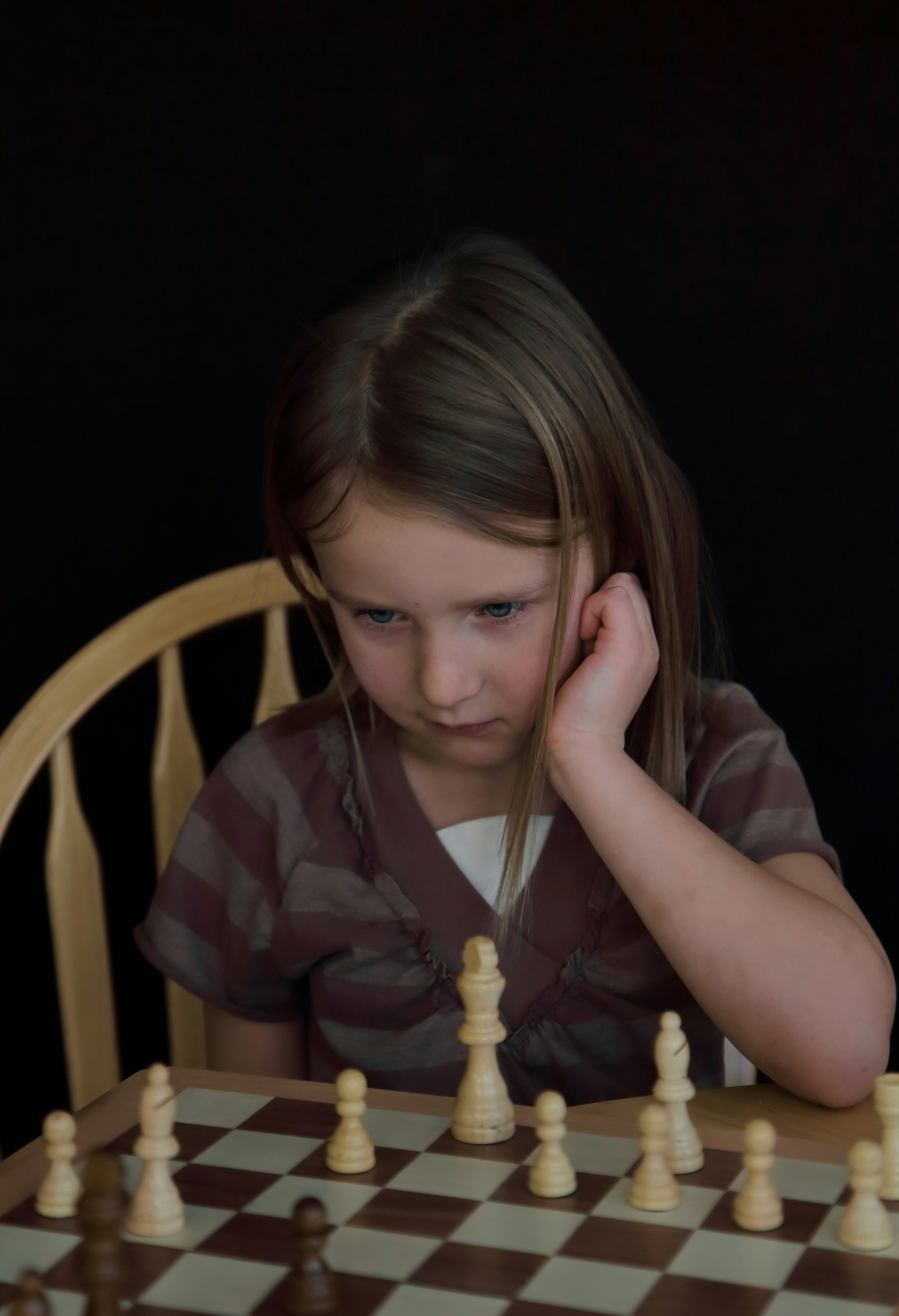 Pensive Move: A Quiet Moment Over the Chessboard