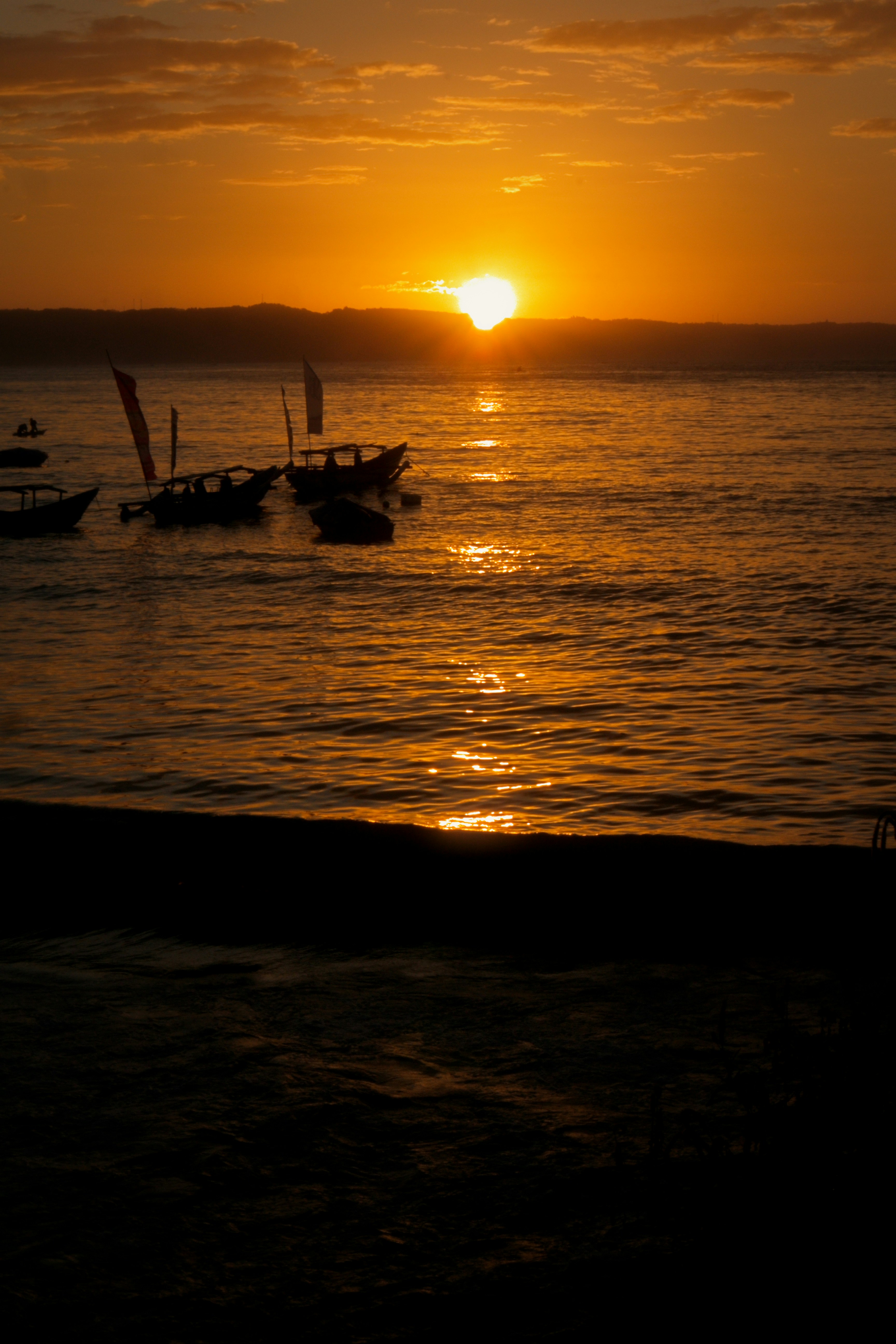 Sunbound Boats at Dusk: Silhouettes and Ripples