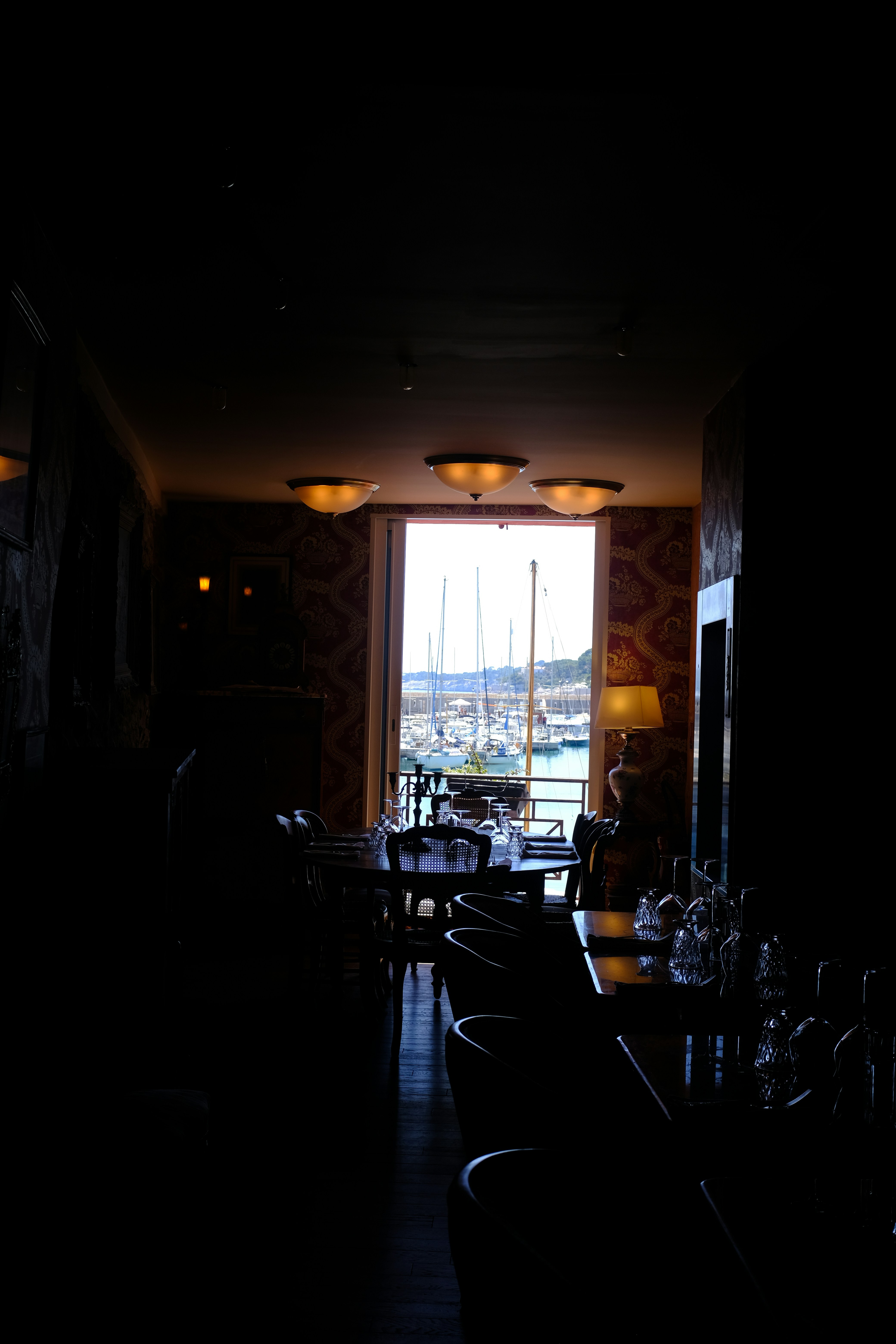 Harbor View Through a Dim Interior