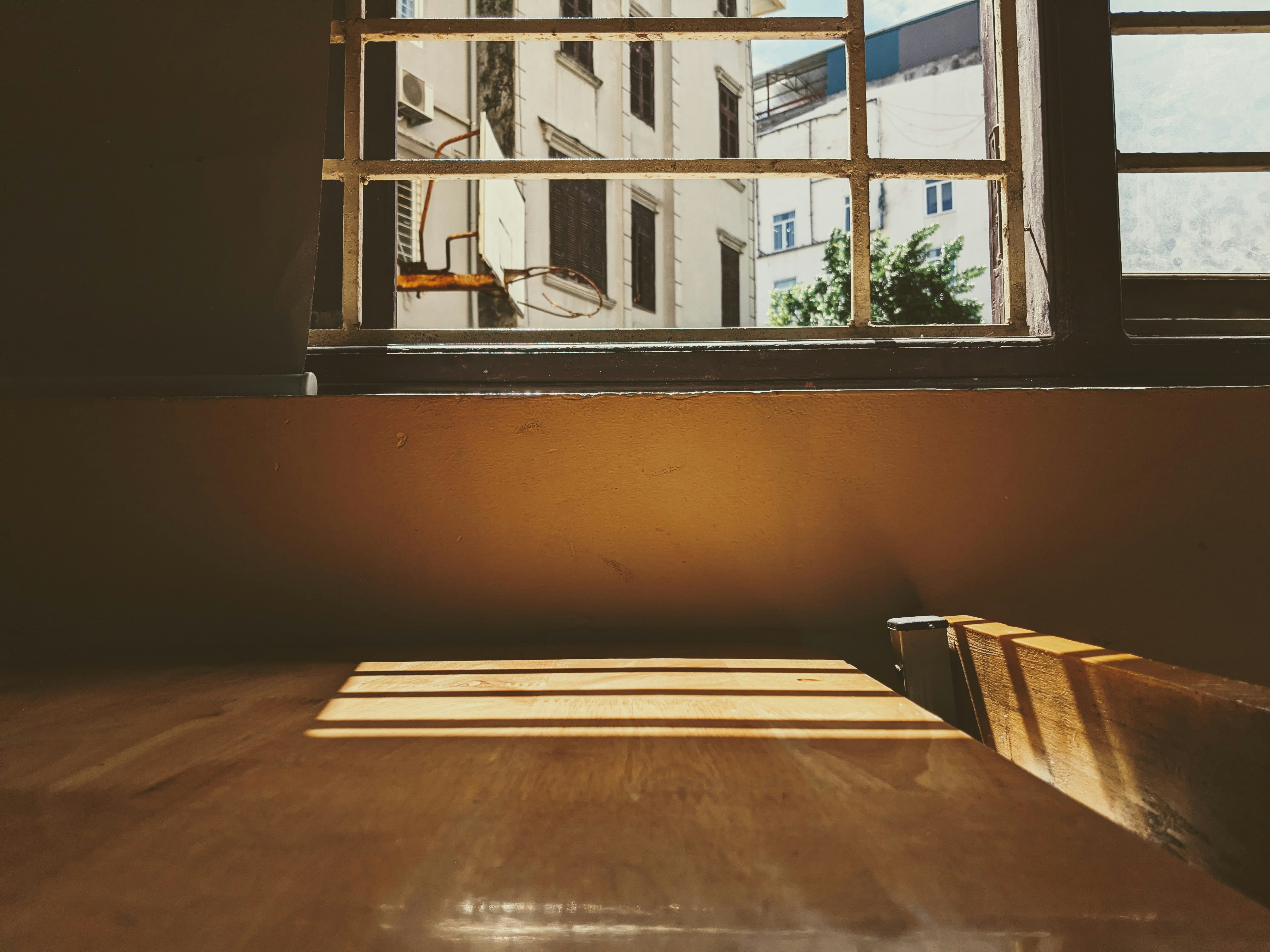 Sunlit Window Bench: Quiet Geometry of Light and Shadow