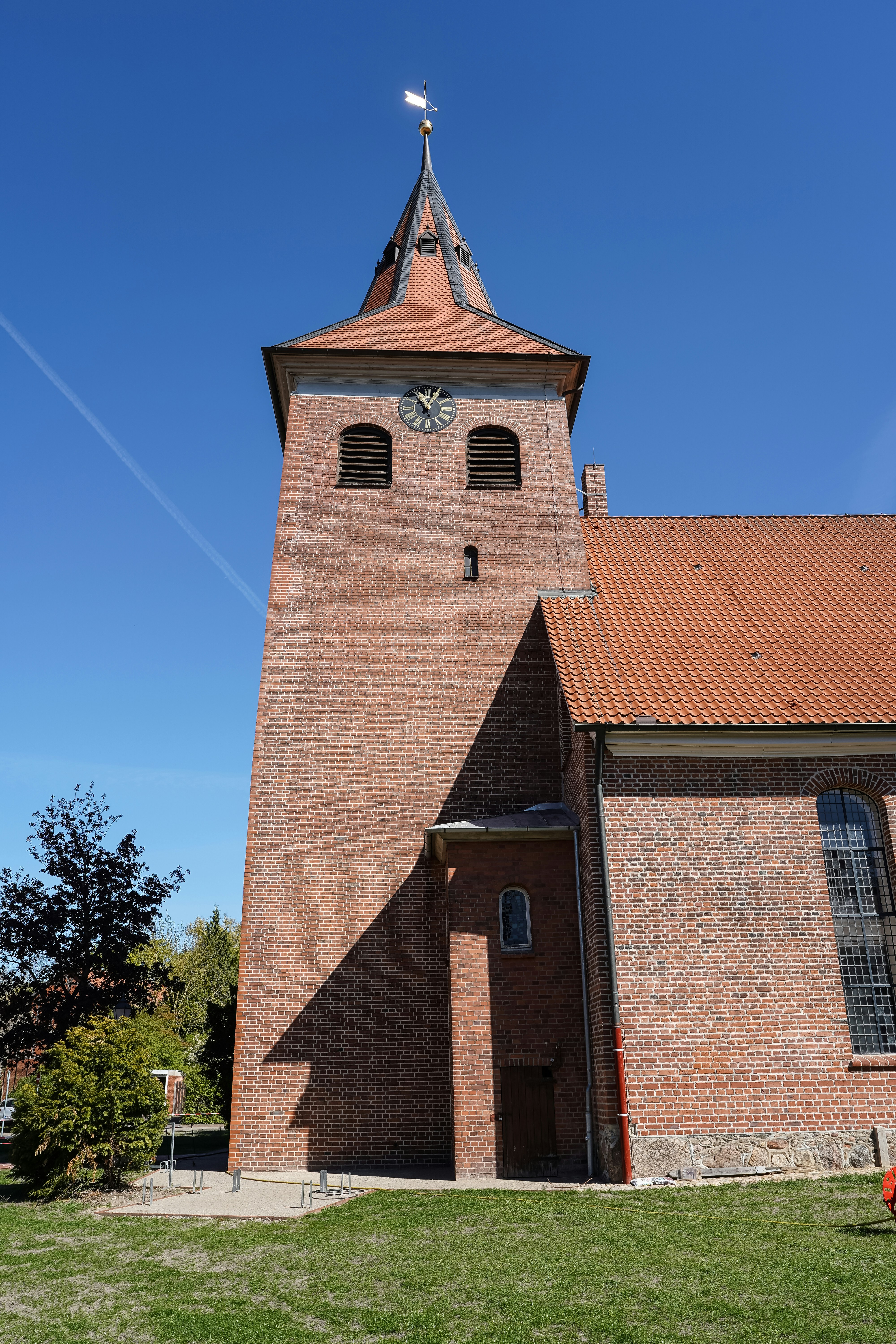Brick Church Tower Reaching Toward a Clear Sky