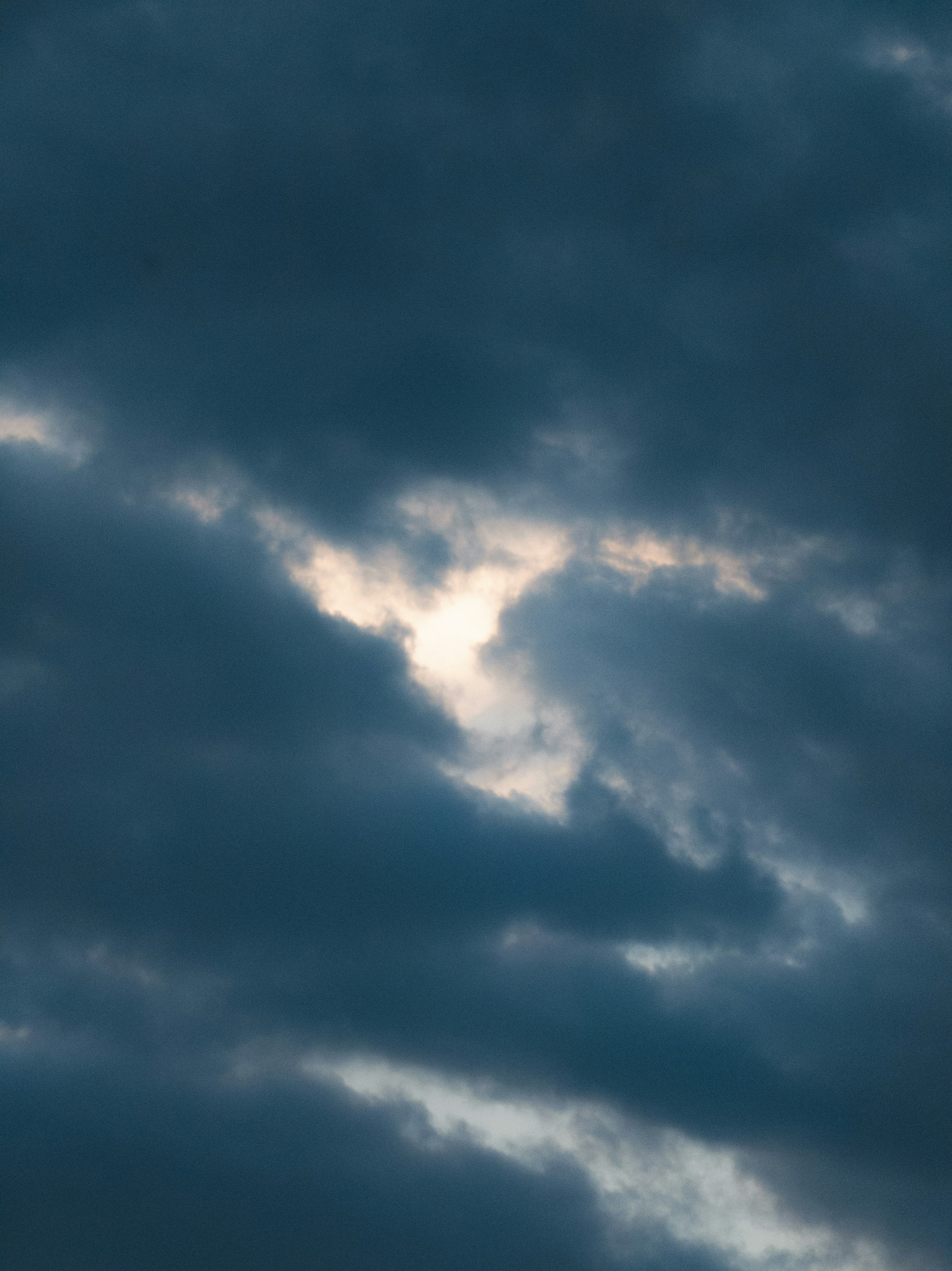 A Break in the Clouds: Subtle Light Pierces the Overcast Sky
