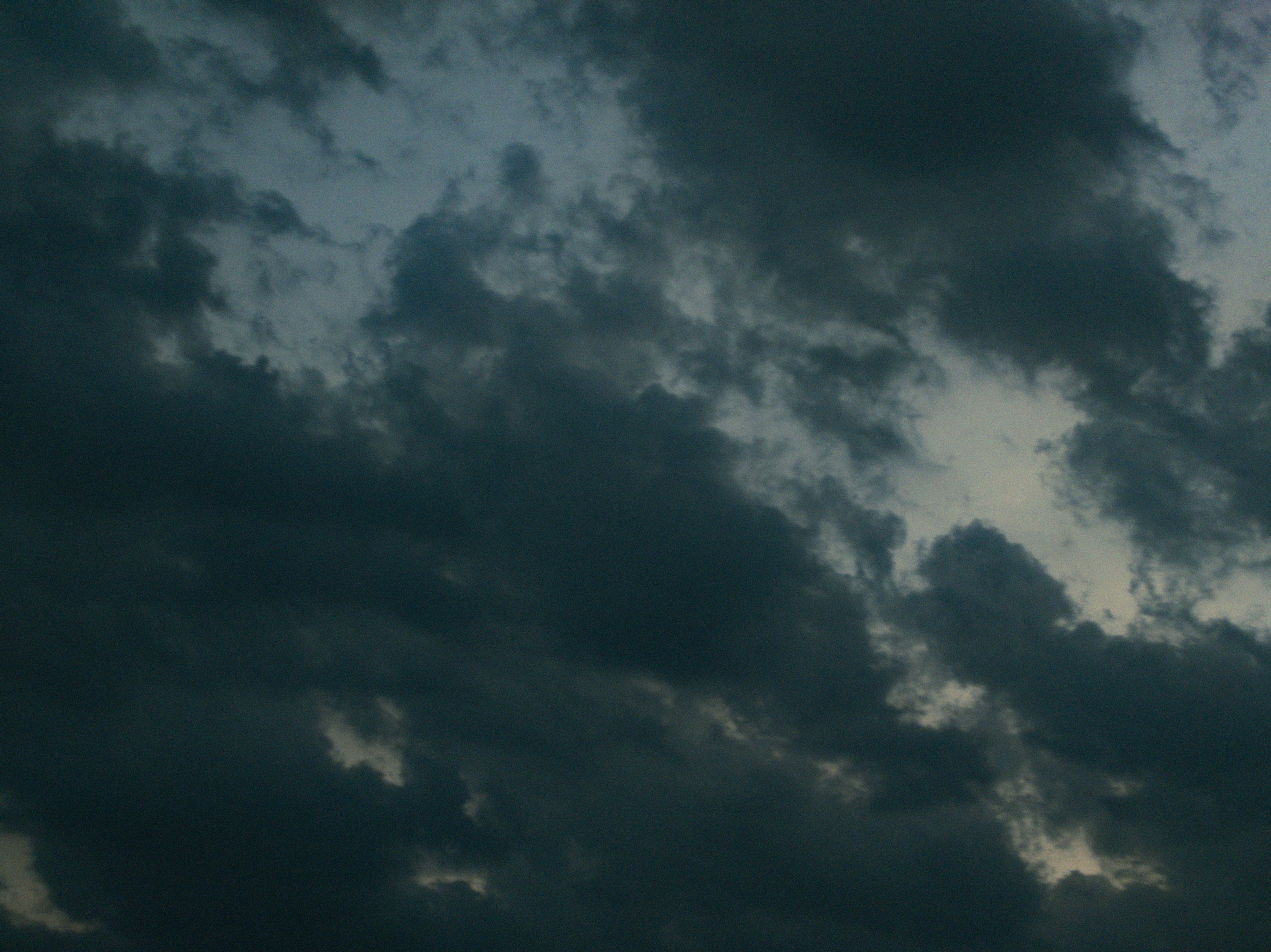 Overcast Ascent: Cloud Veil Across the Dusk