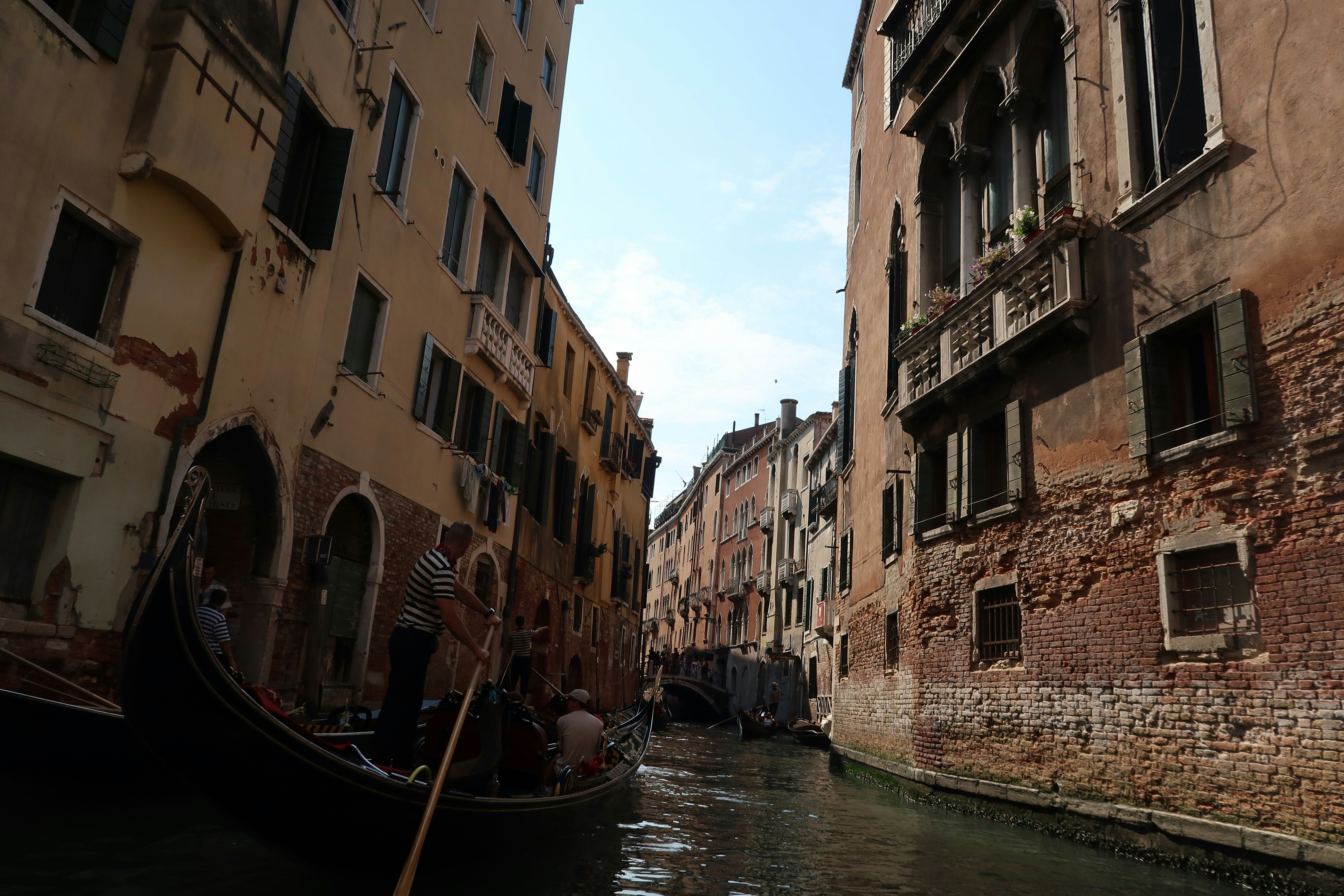 Canal Vistas: Gondolas and Weathered Facades in Morning Light