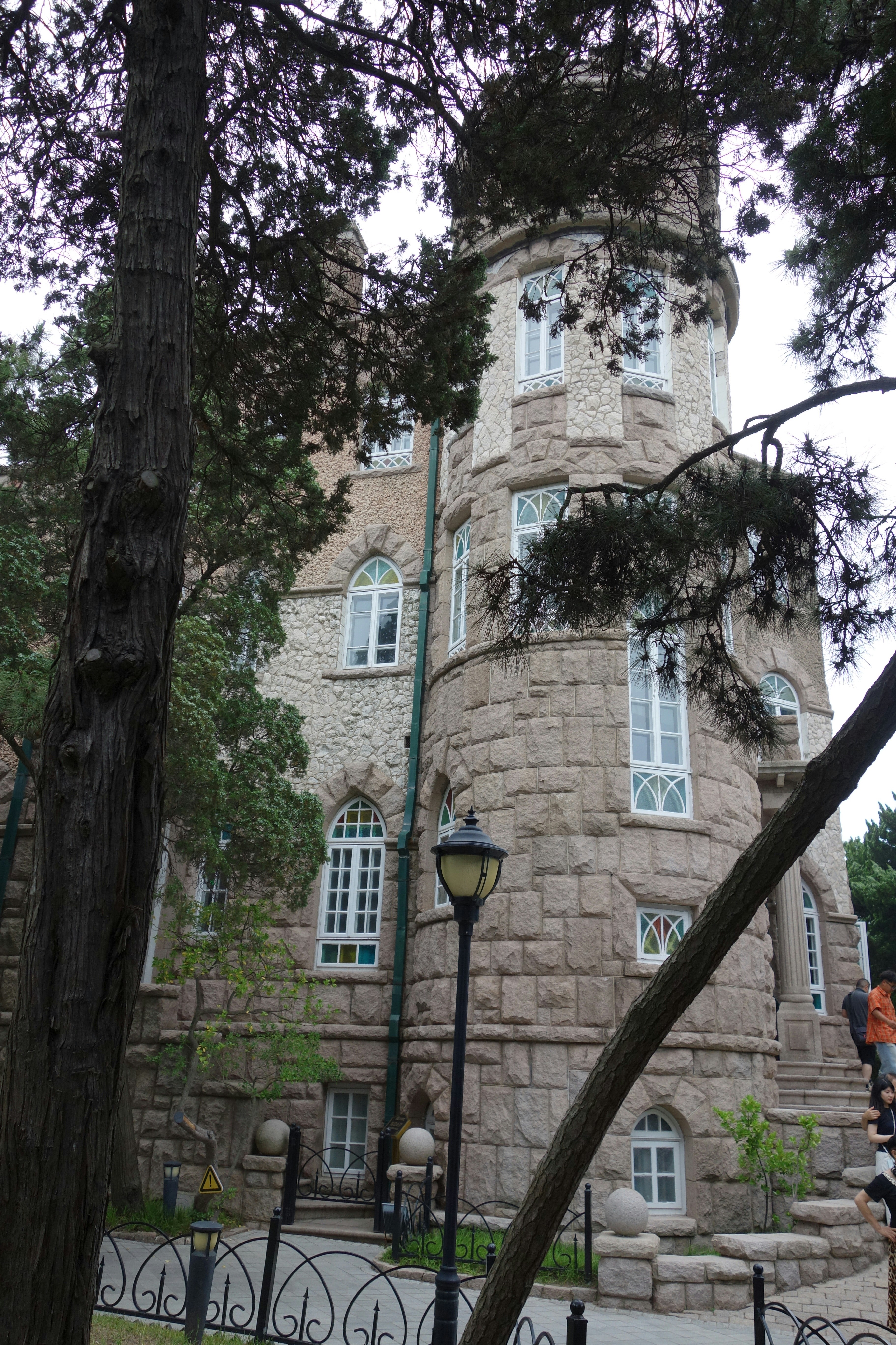 Castle in the Pines: A Towered Facade Surrounded by Trees