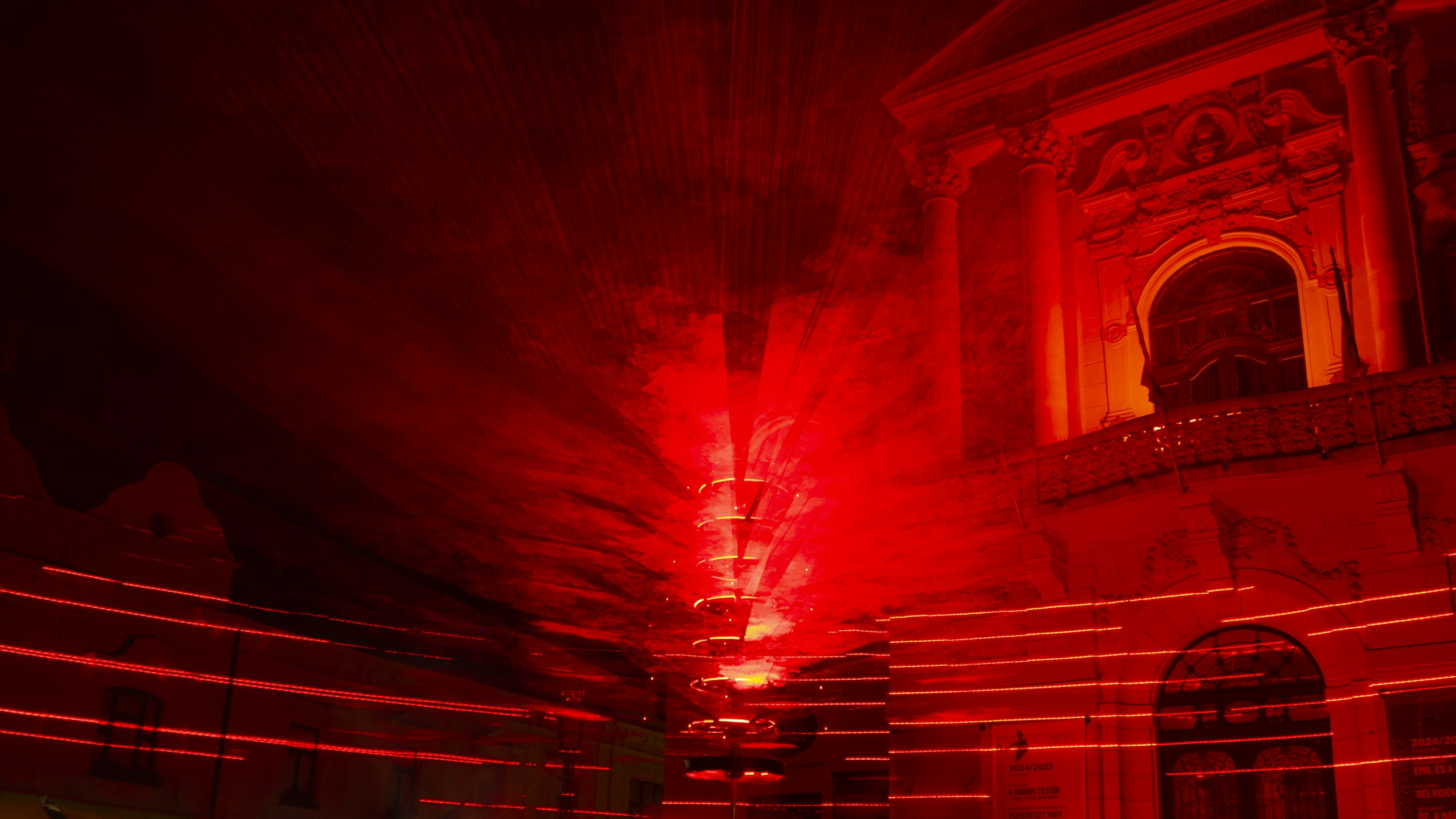 Red Cathedral Lights: Long-Exposure Streaks Over a Historic Facade