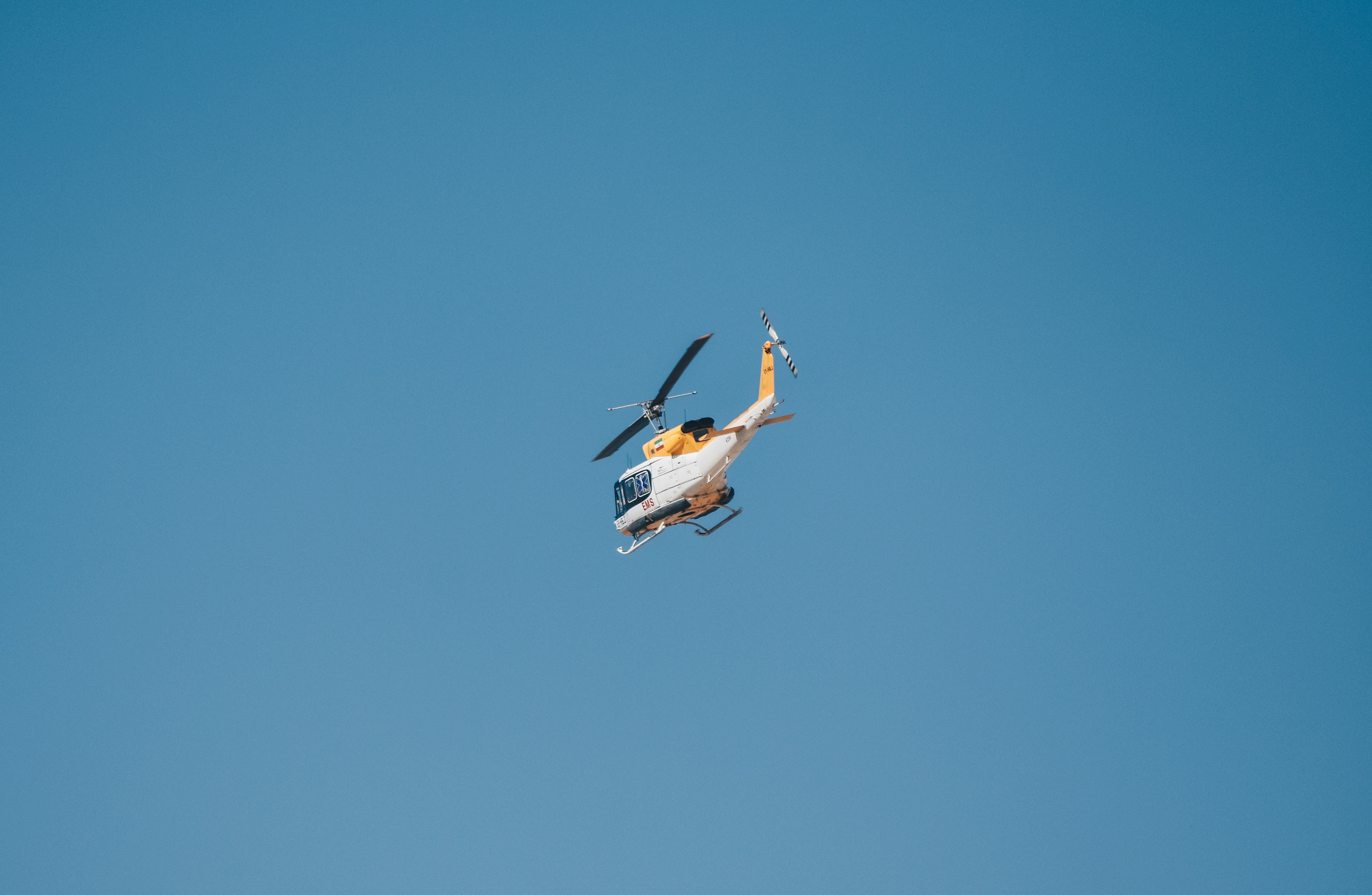 Air Rescue in a Seaside Blue: A helicopter suspended against a clear sky