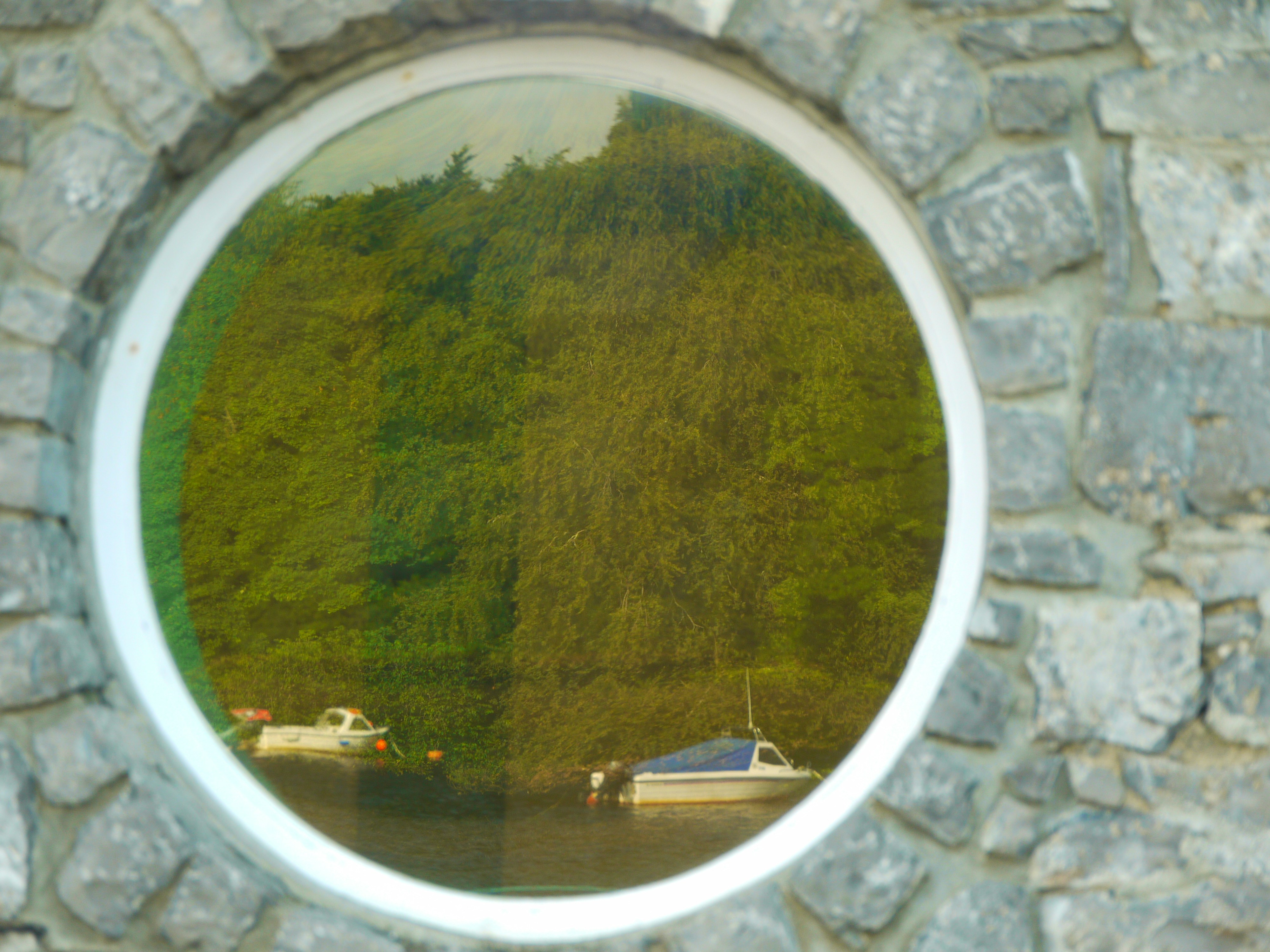 Circular Window to Calm Waters: Reflections in a Stone Lens
