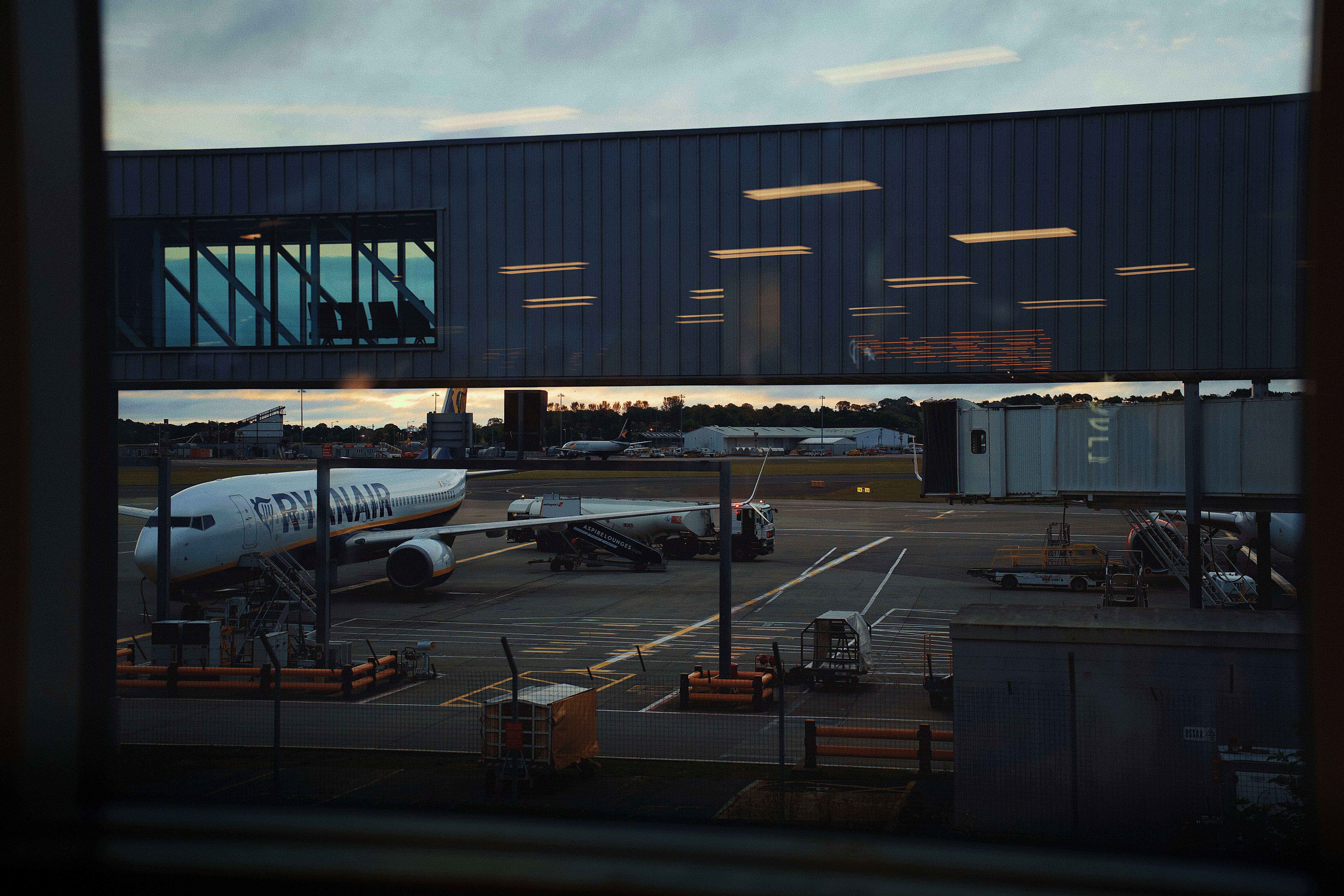 Gate to Departure: Evening Aircraft at the Terminal Window