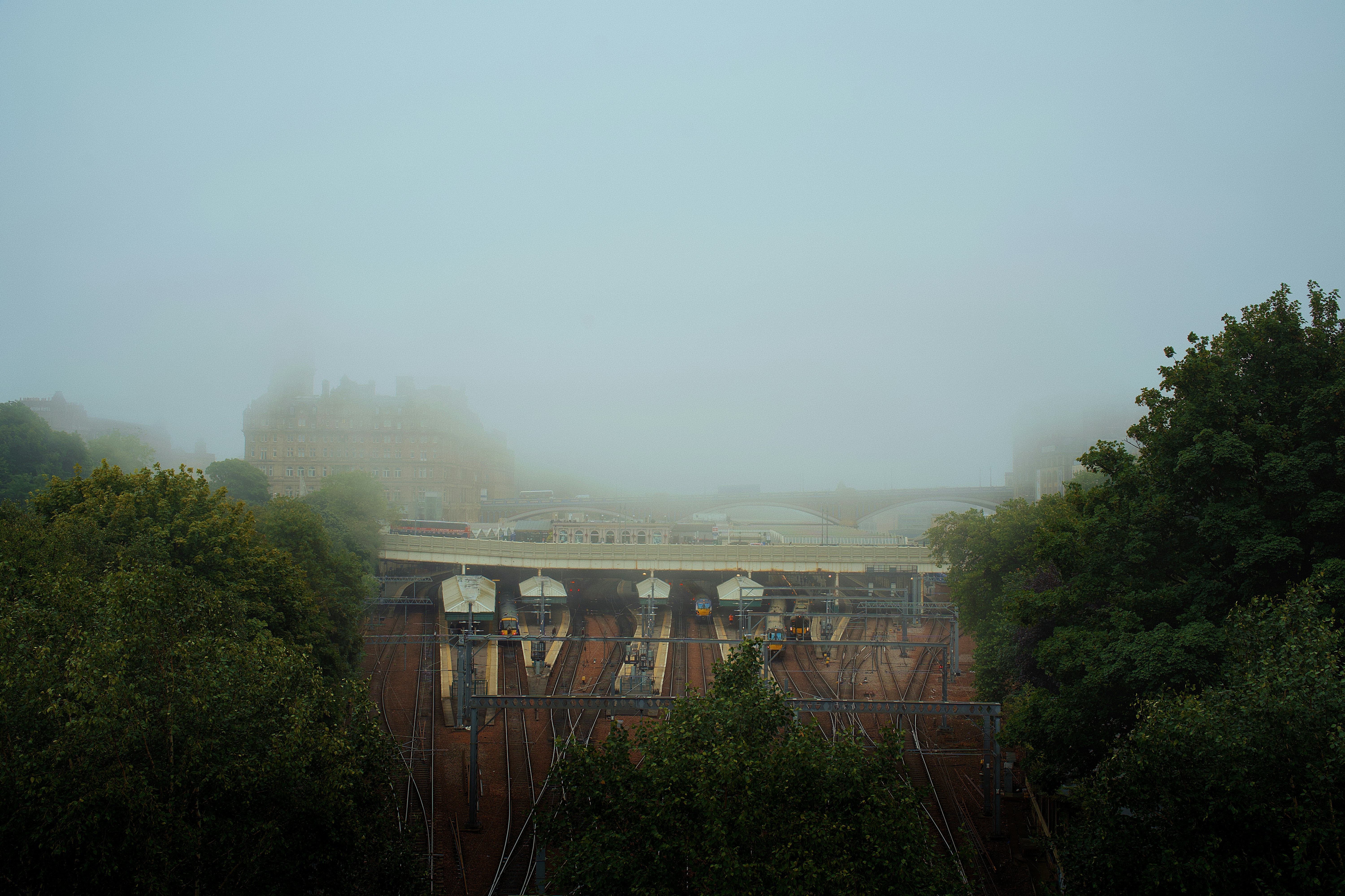 Fog over the Tracks: A Quiet Dawn at the City Bridge