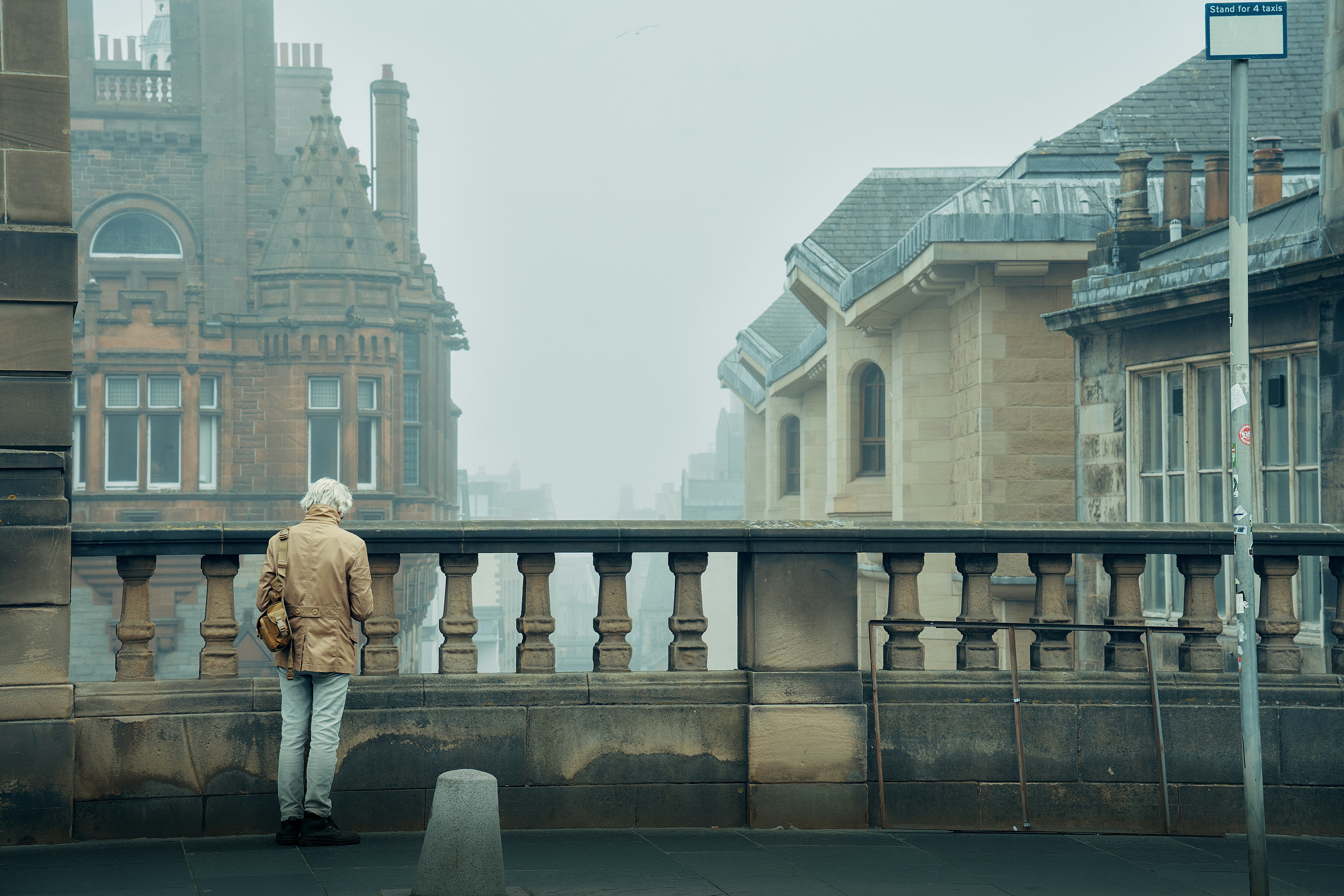 Lonely Figure on the Bridge: A Quiet Morning in Mist