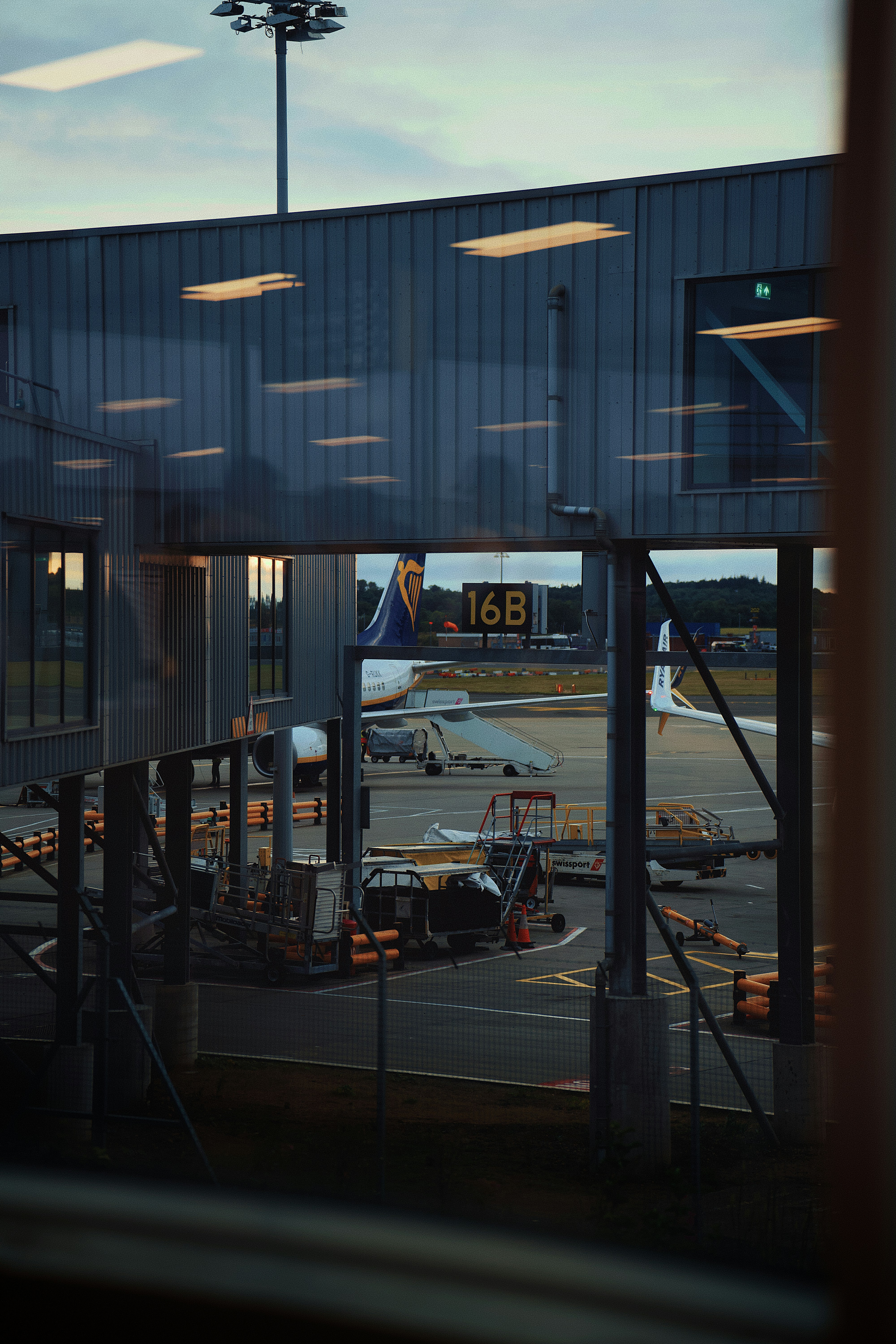 Gate to the Gate: A View Through the Terminal Window at Sunset