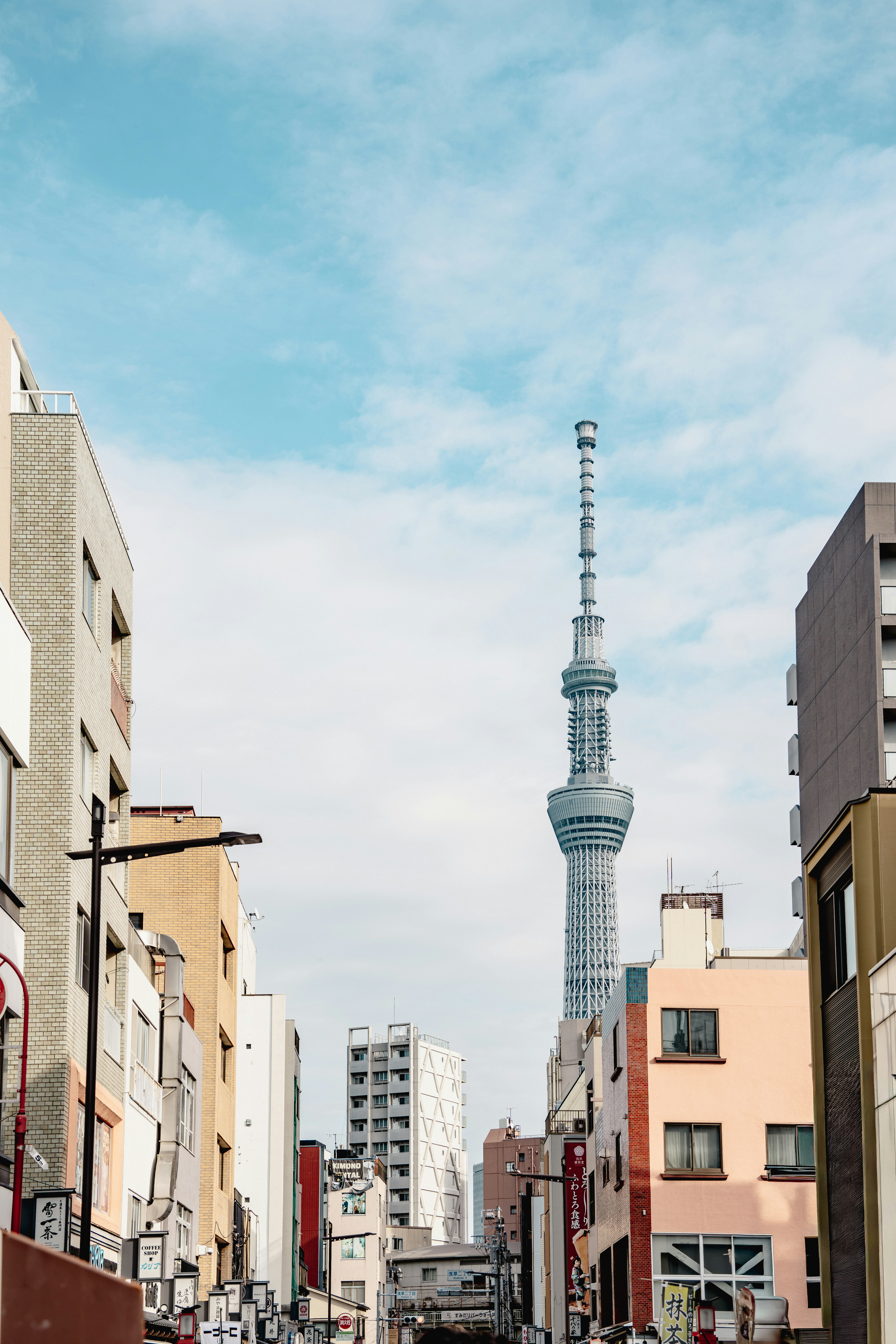 Tokyo Tower Rising Above a Quiet City Street
