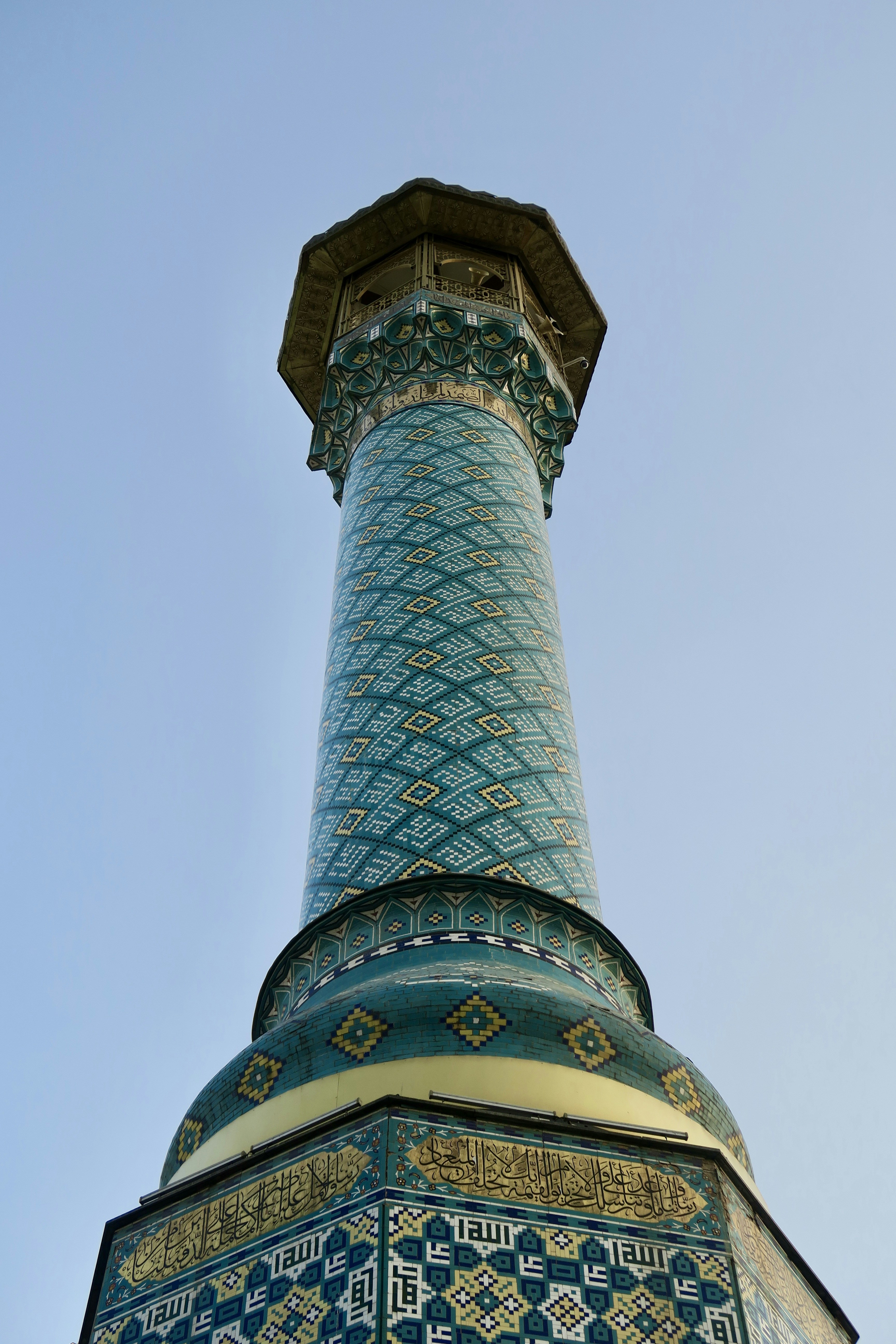 Turquoise Minaret Rising Against a Clear Sky