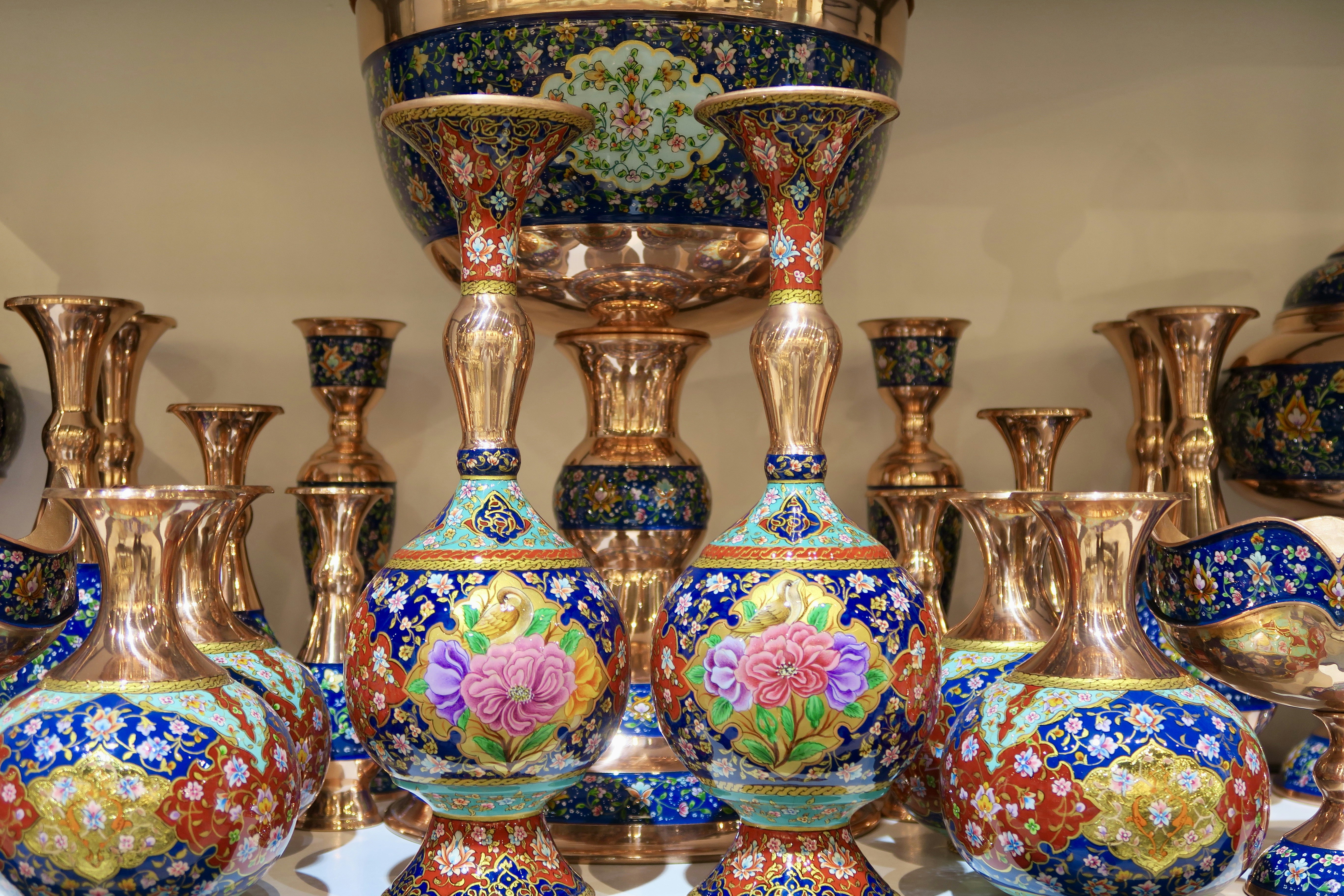 Ceramic Reverie: A Symmetry of Ornate Vases in a Glowing Display