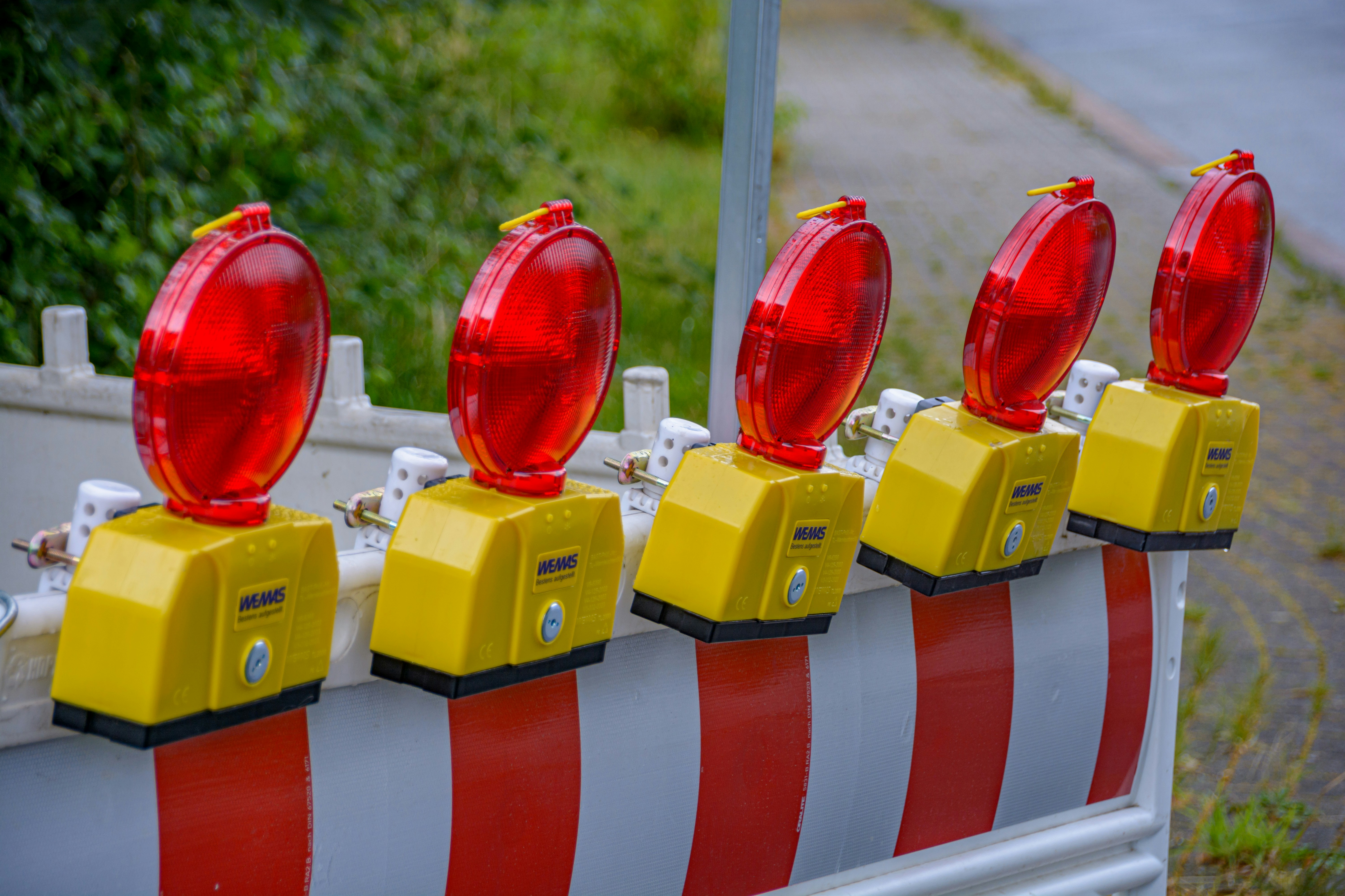 Line of Warning Lights: A Row of Traffic Barriers in Bright Safety Yellow