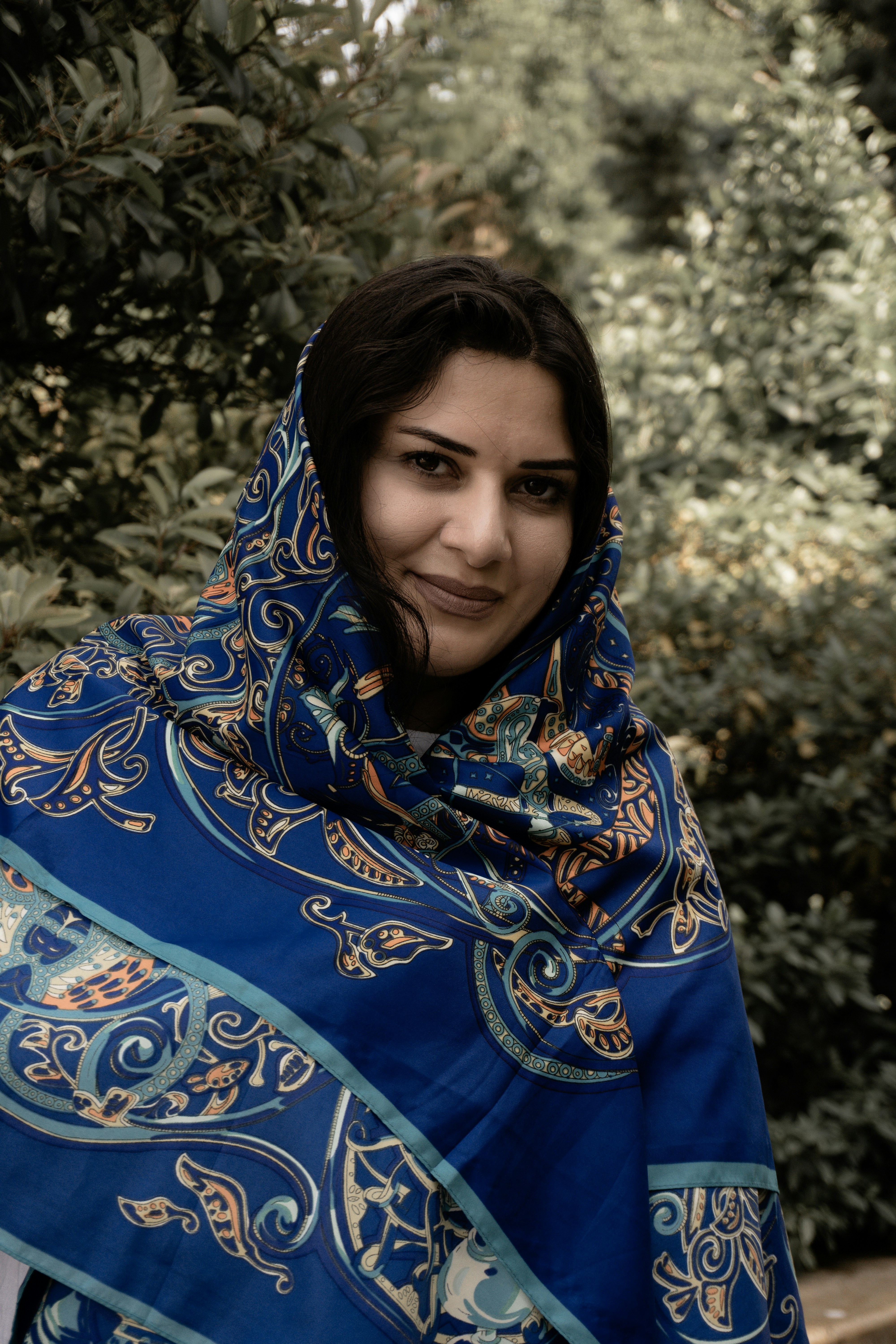 Hidden Smile Under a Blue Silk Veil