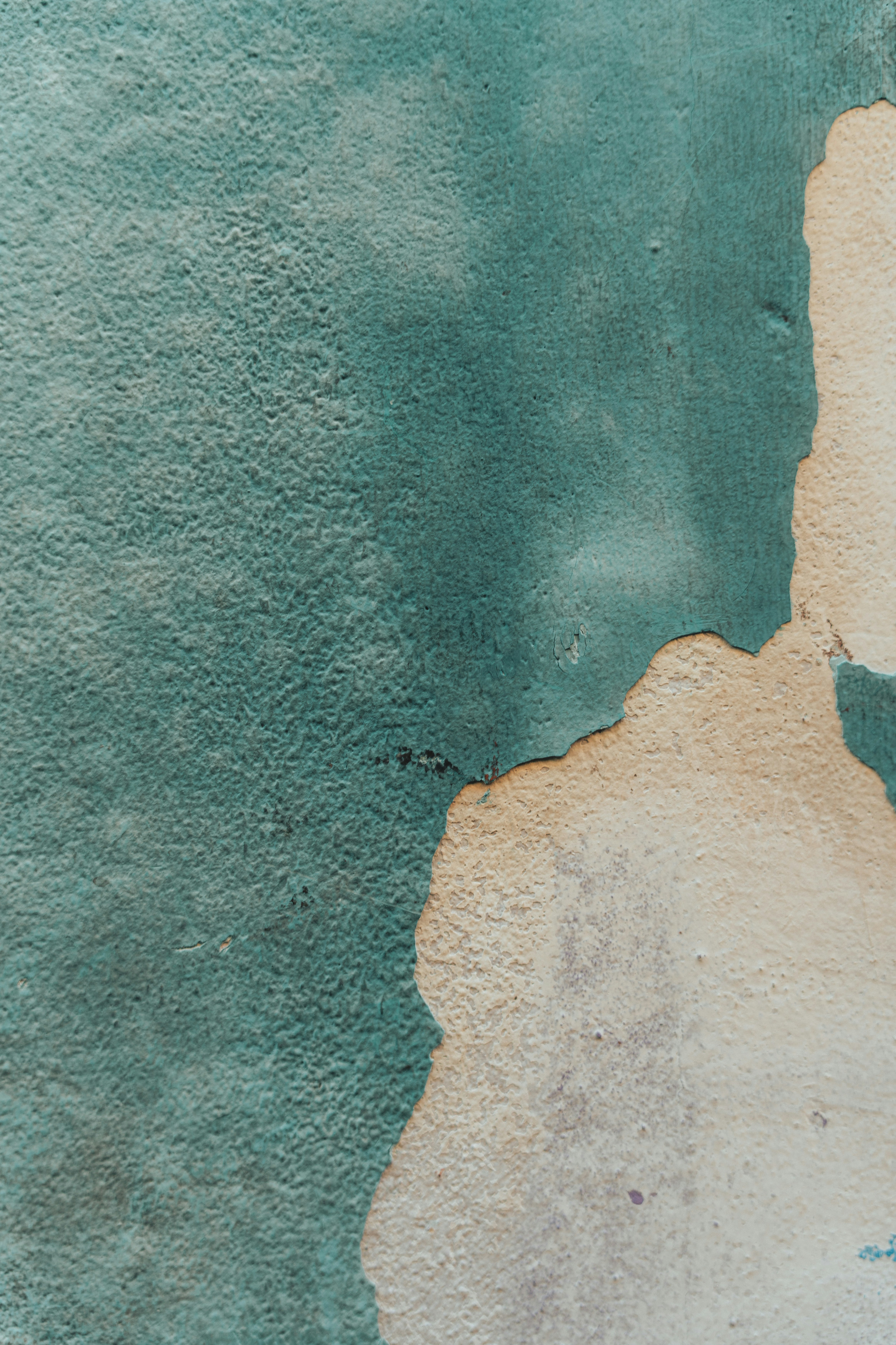 Weathered Teal Wall – Cracked Paint with Sandstone Accents