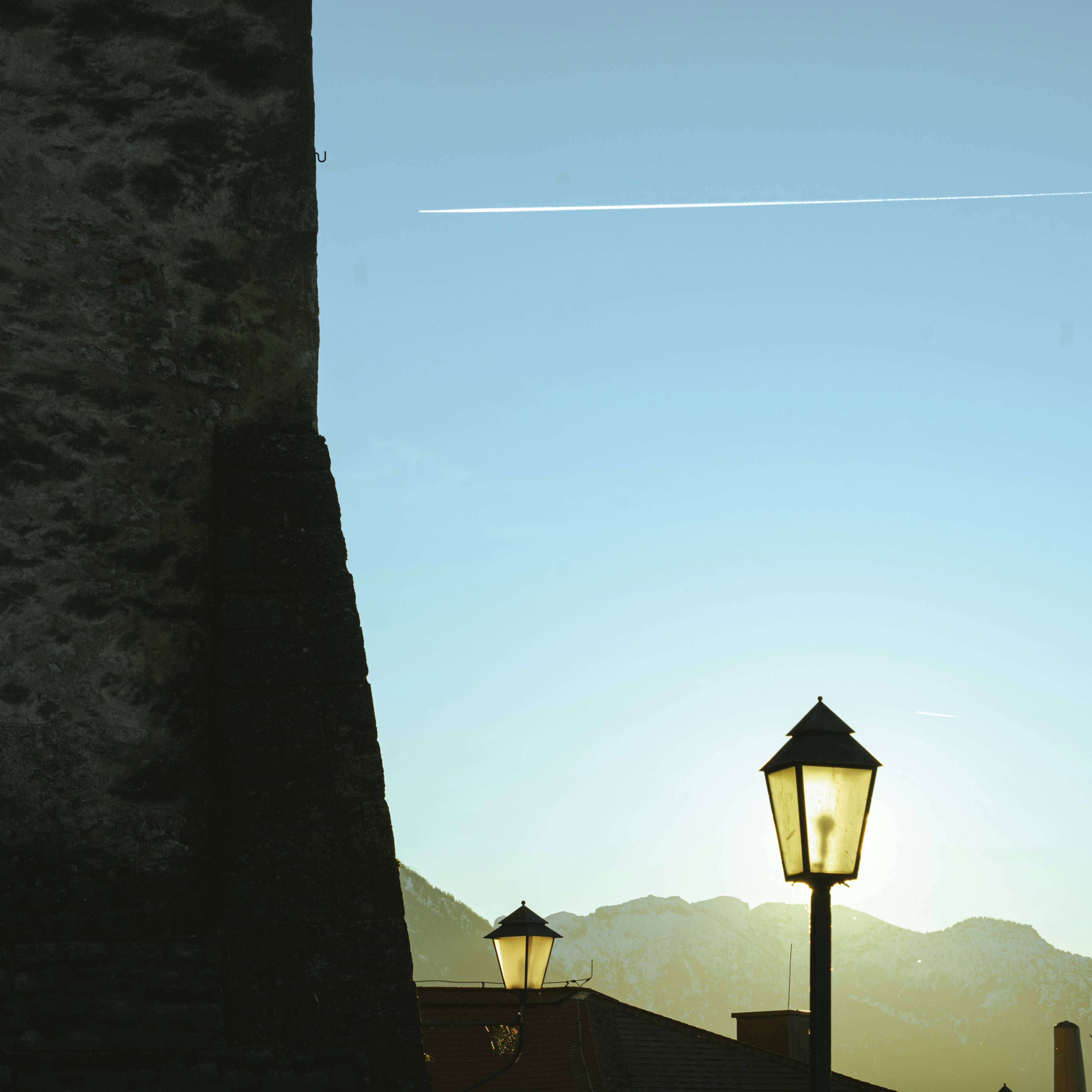 Lamplight Against a Distant Alpine Spine