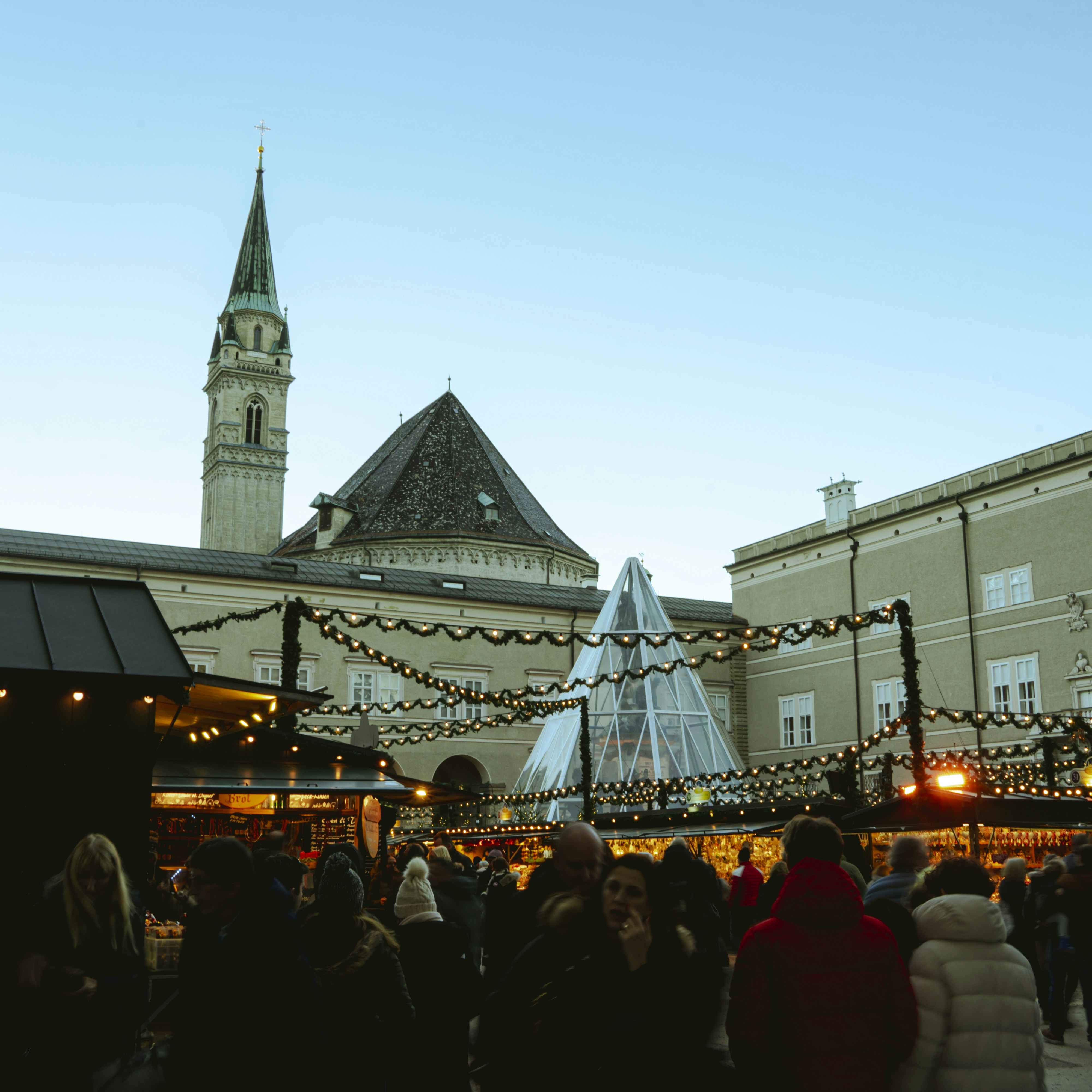 Holiday Market Glow Under a Historic Clocktower