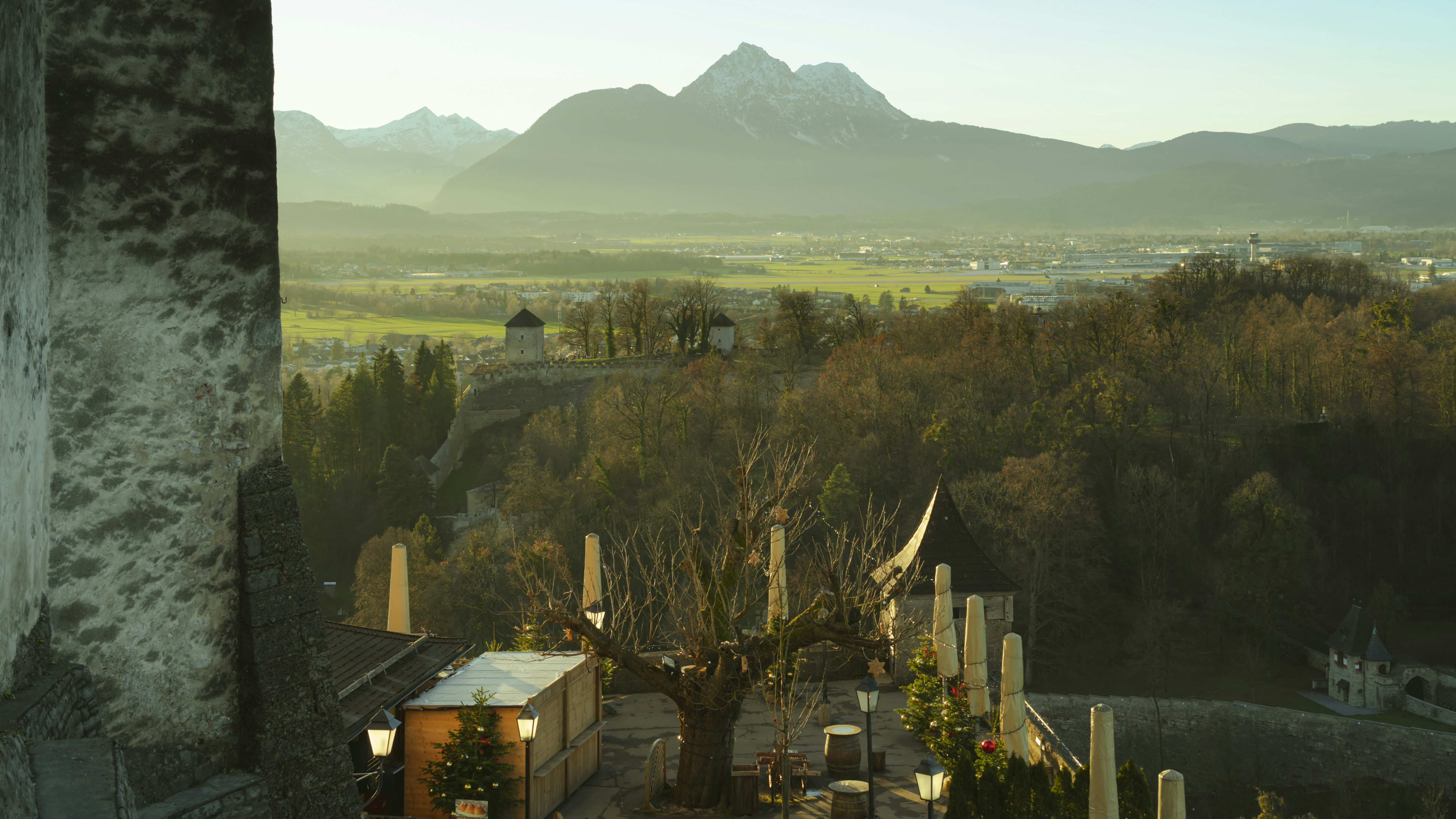 Castle Courtyard at Dusk: A Quiet Valley View from the Fortified Wall