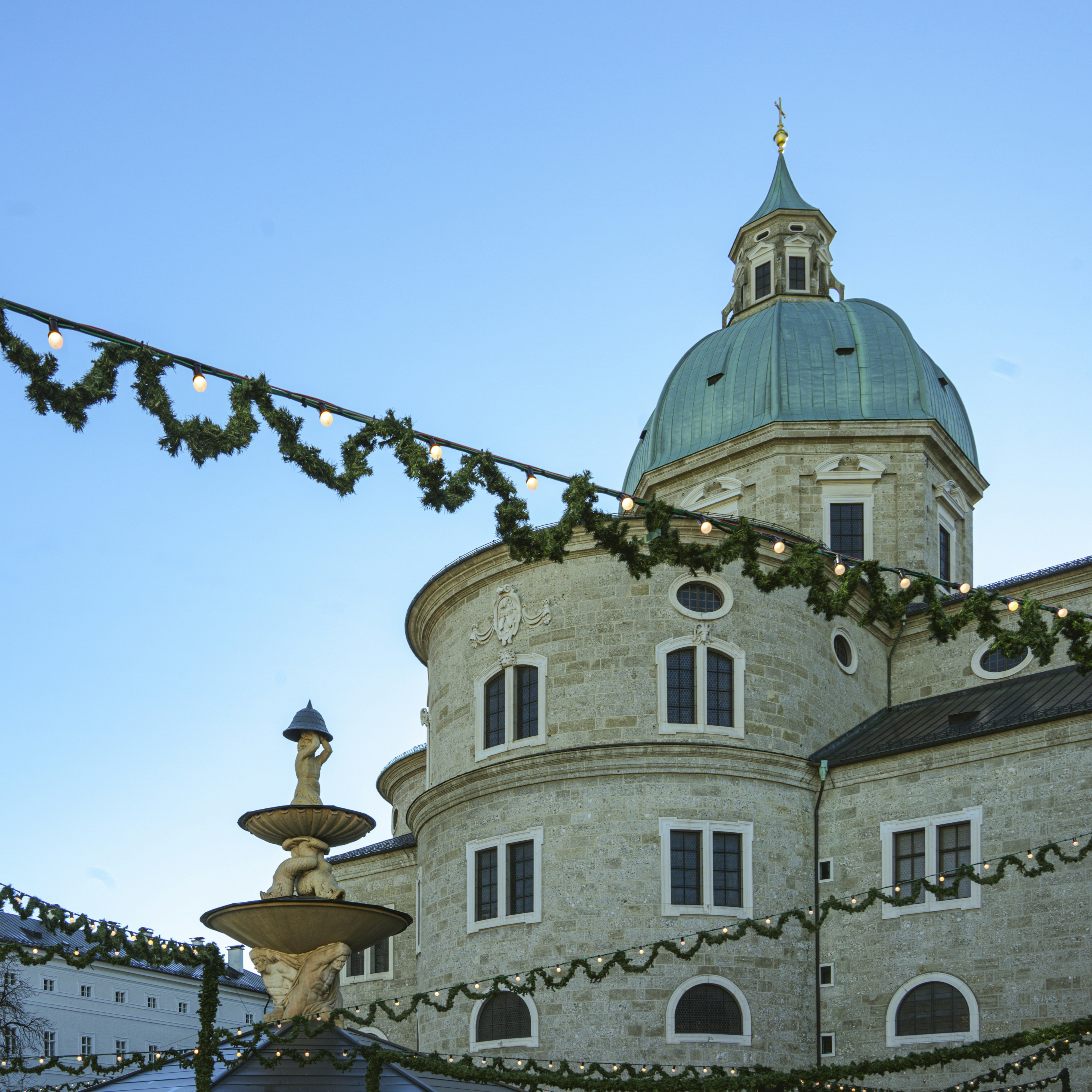 Pastel Dome Over Courtyard Clocked by Garlanded Lights