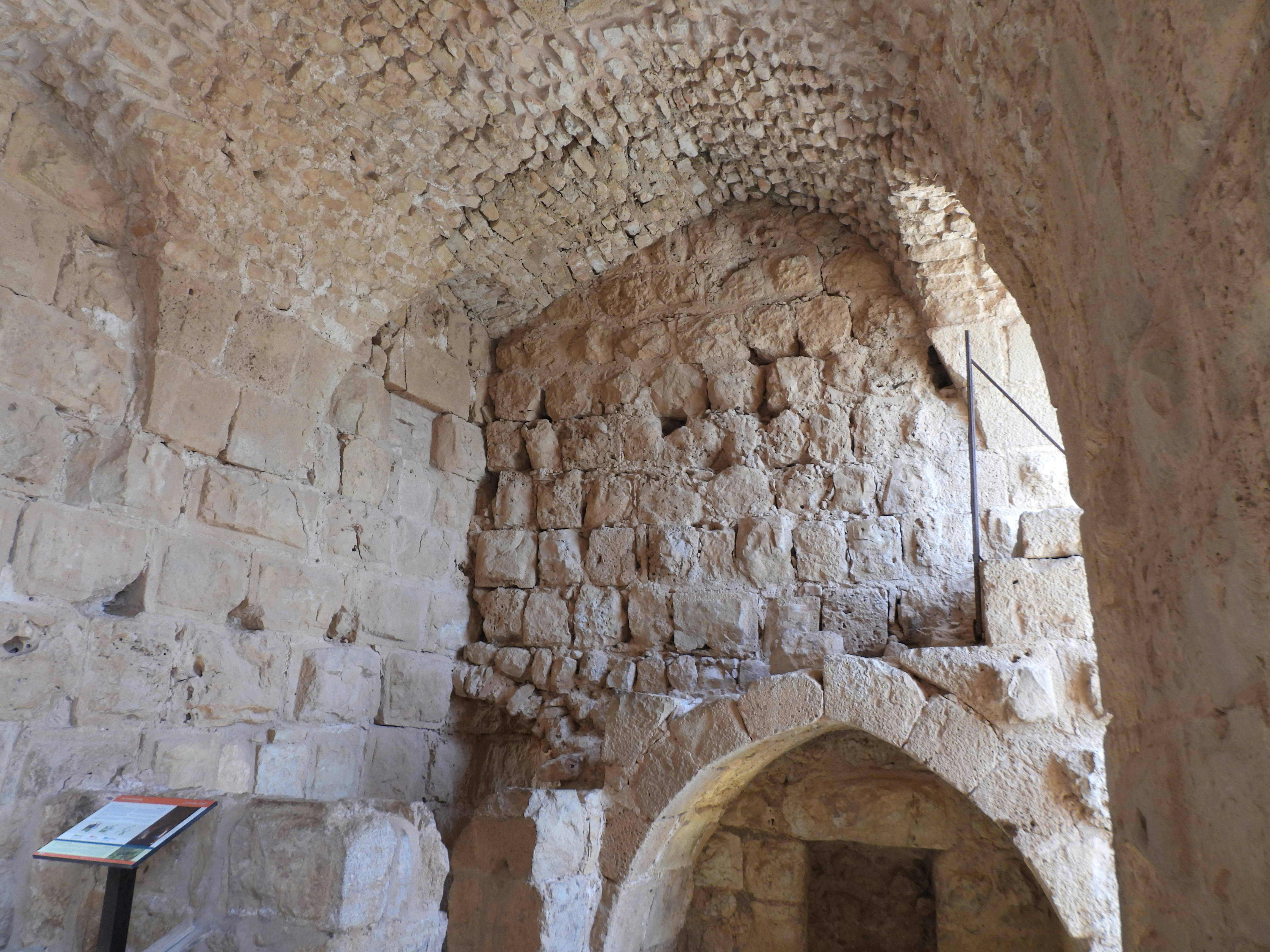 Stone Archway Corridor: Timeless Carved Walls in an Ancient Narthex