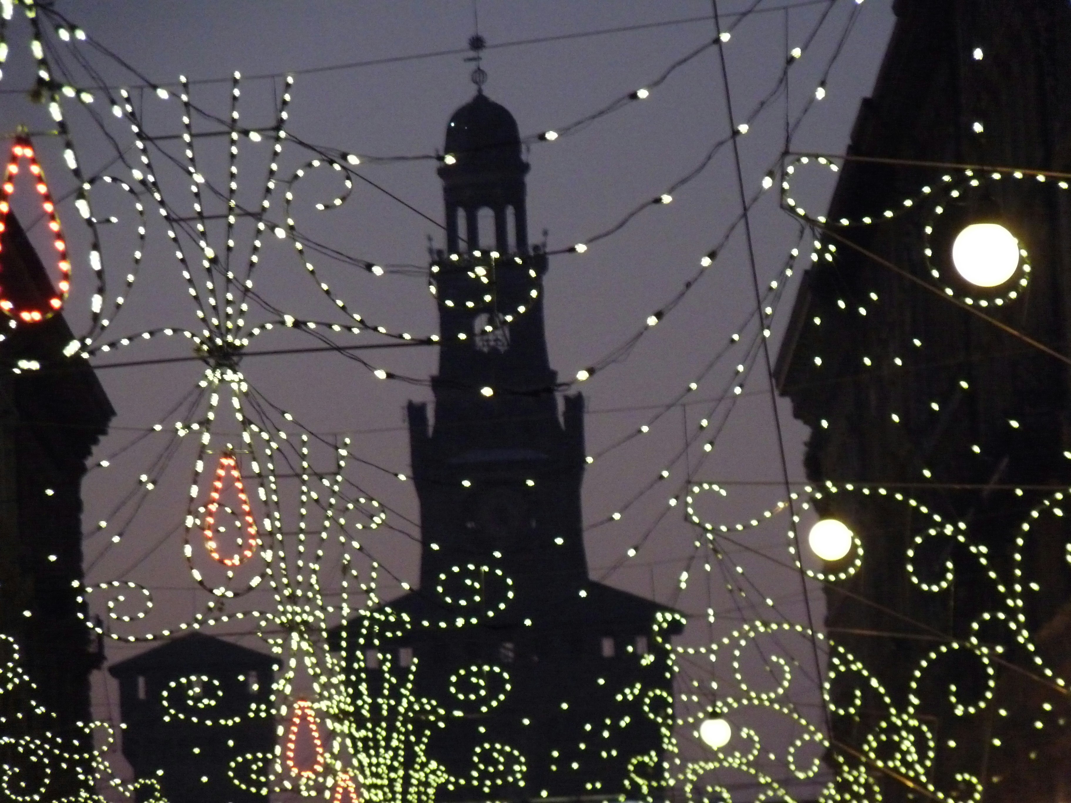 Twinkling Arcades Over a Medieval Town Square