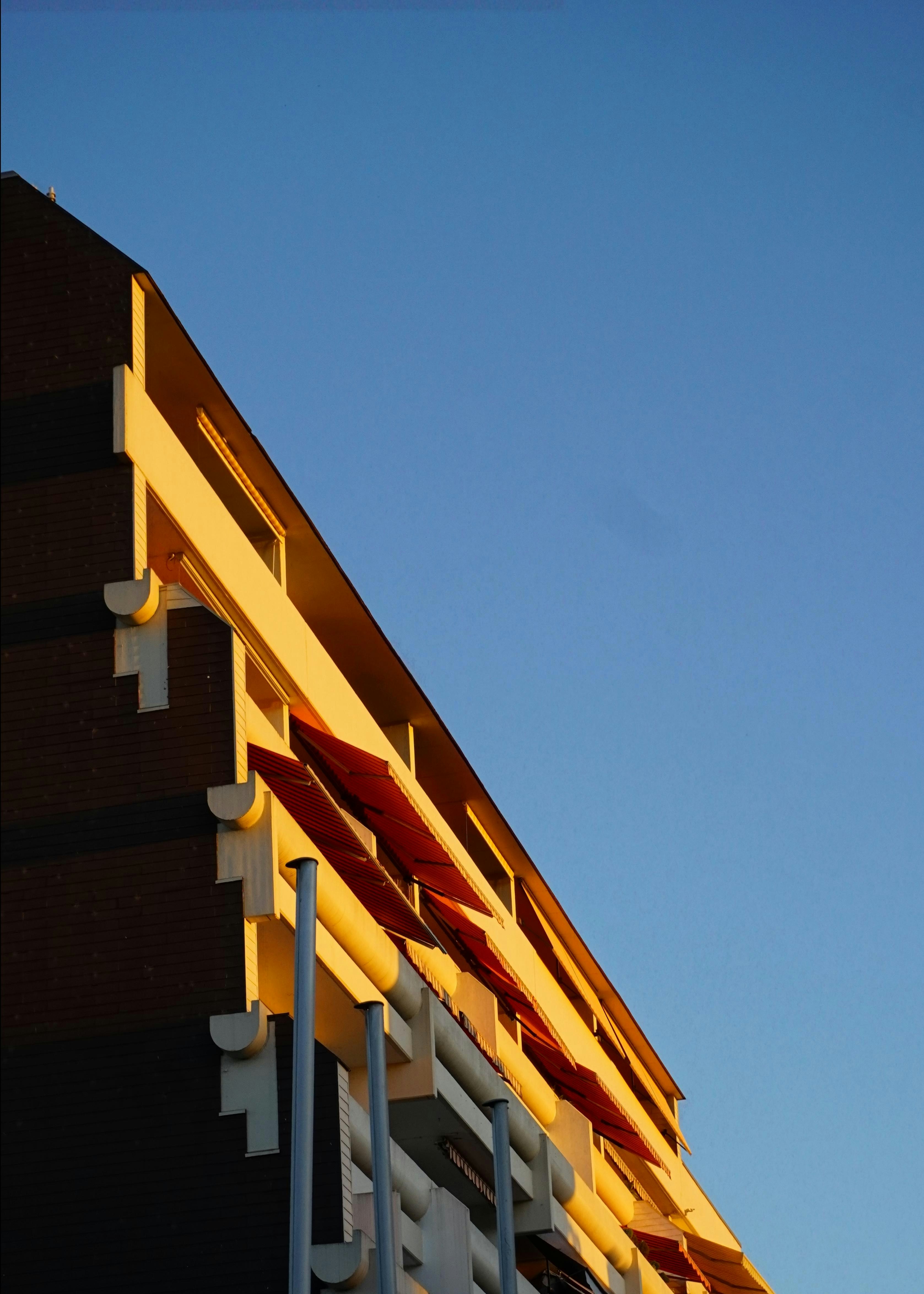 Golden Hour Facade: Sunlit Edges on a Modern Apartment Block
