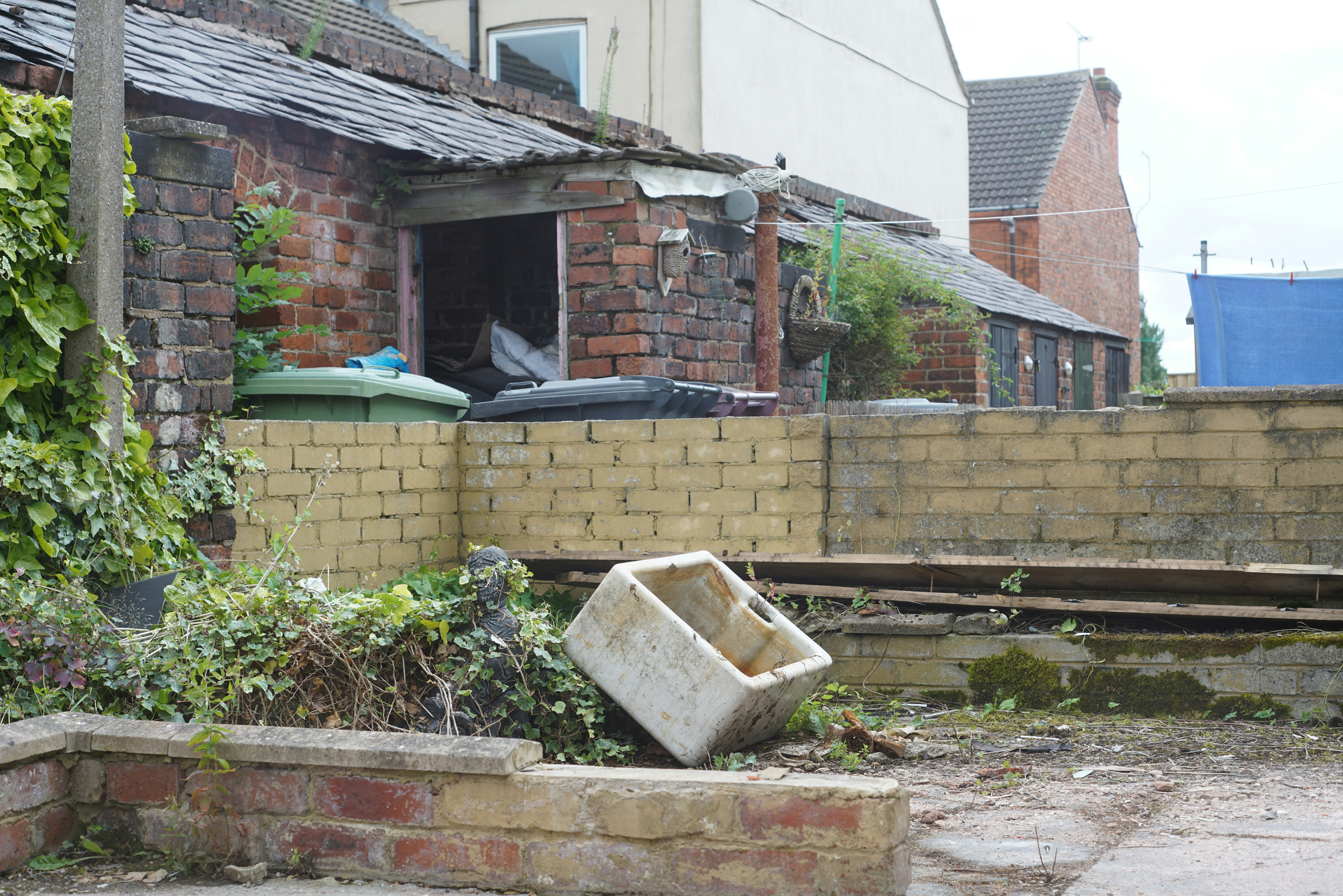 Discarded Cube in a Quiet Yard