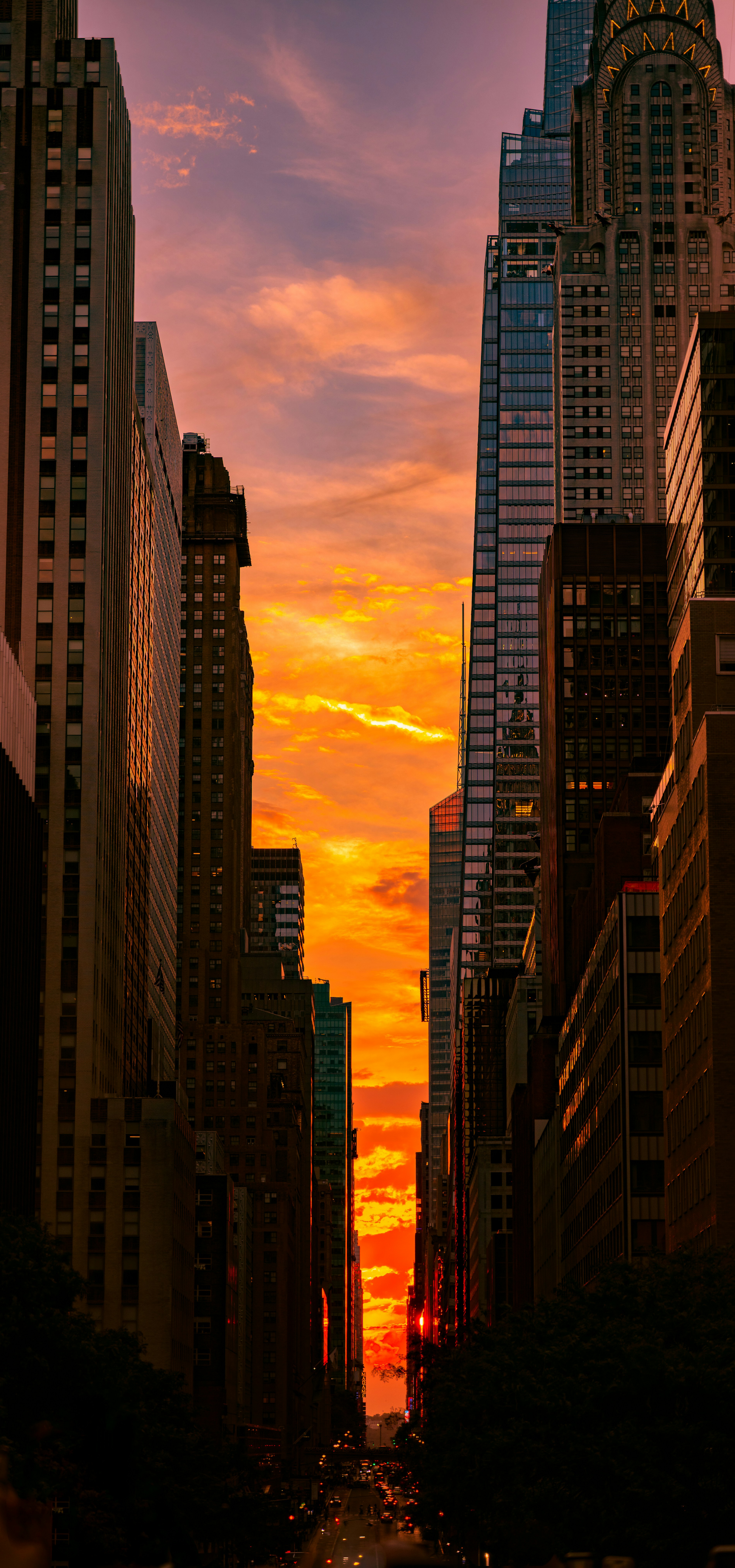 Dusk Between Giants: A Sunset Corridor of Glass and Stone