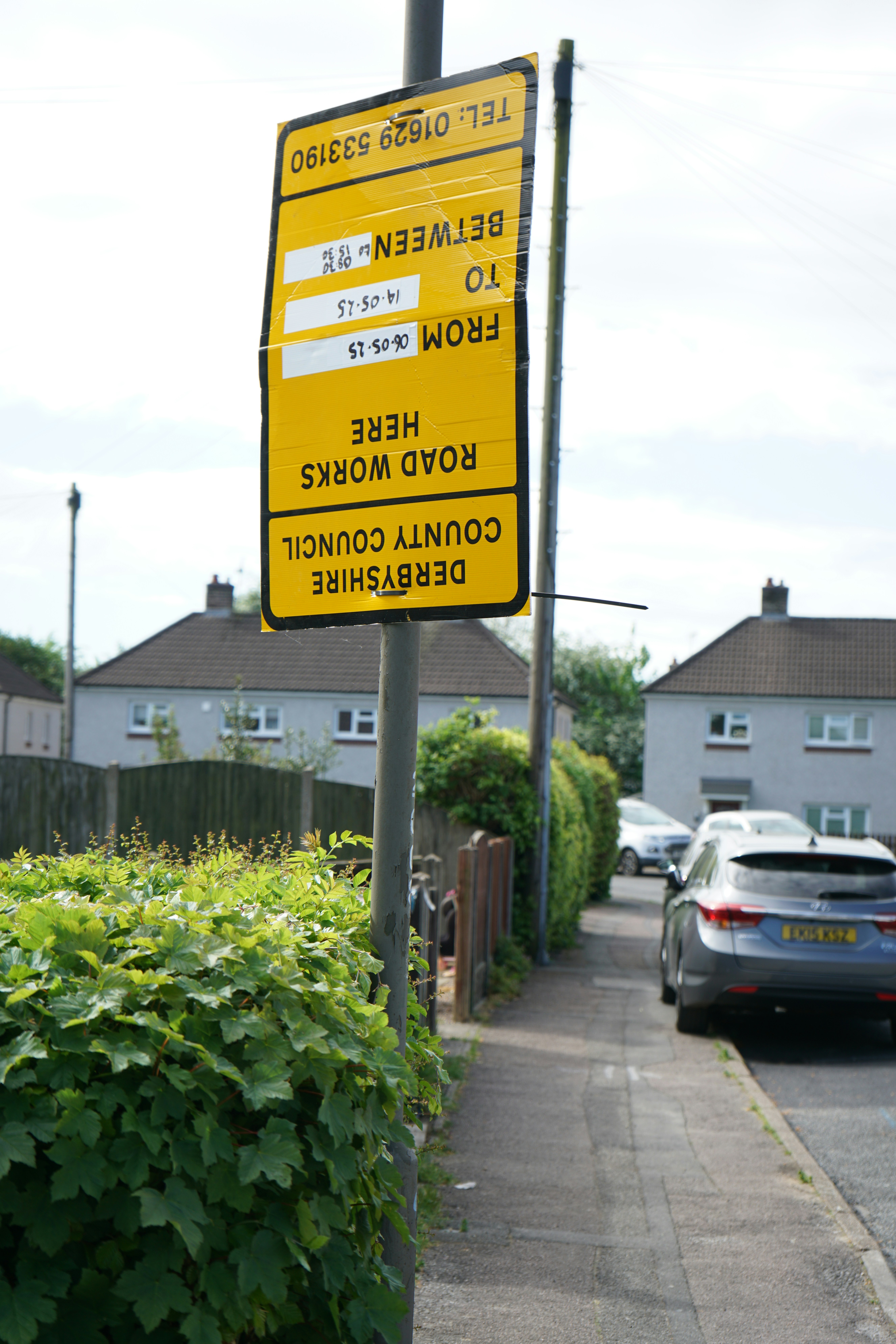 Upside-Down Signover: A Quiet Drive with a Bright Yellow Warning