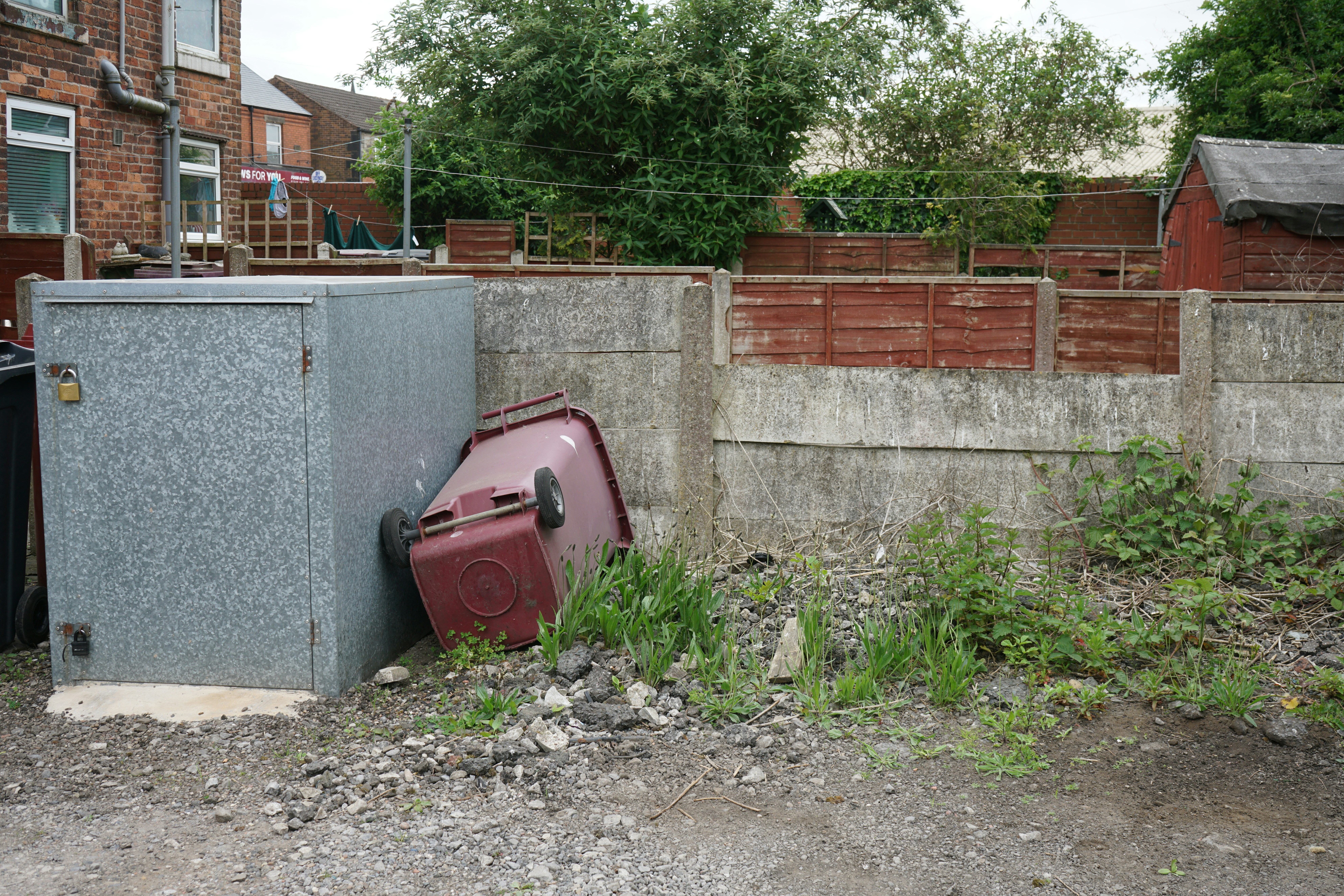 The Red Tipped Canister Among Gravel and Concrete