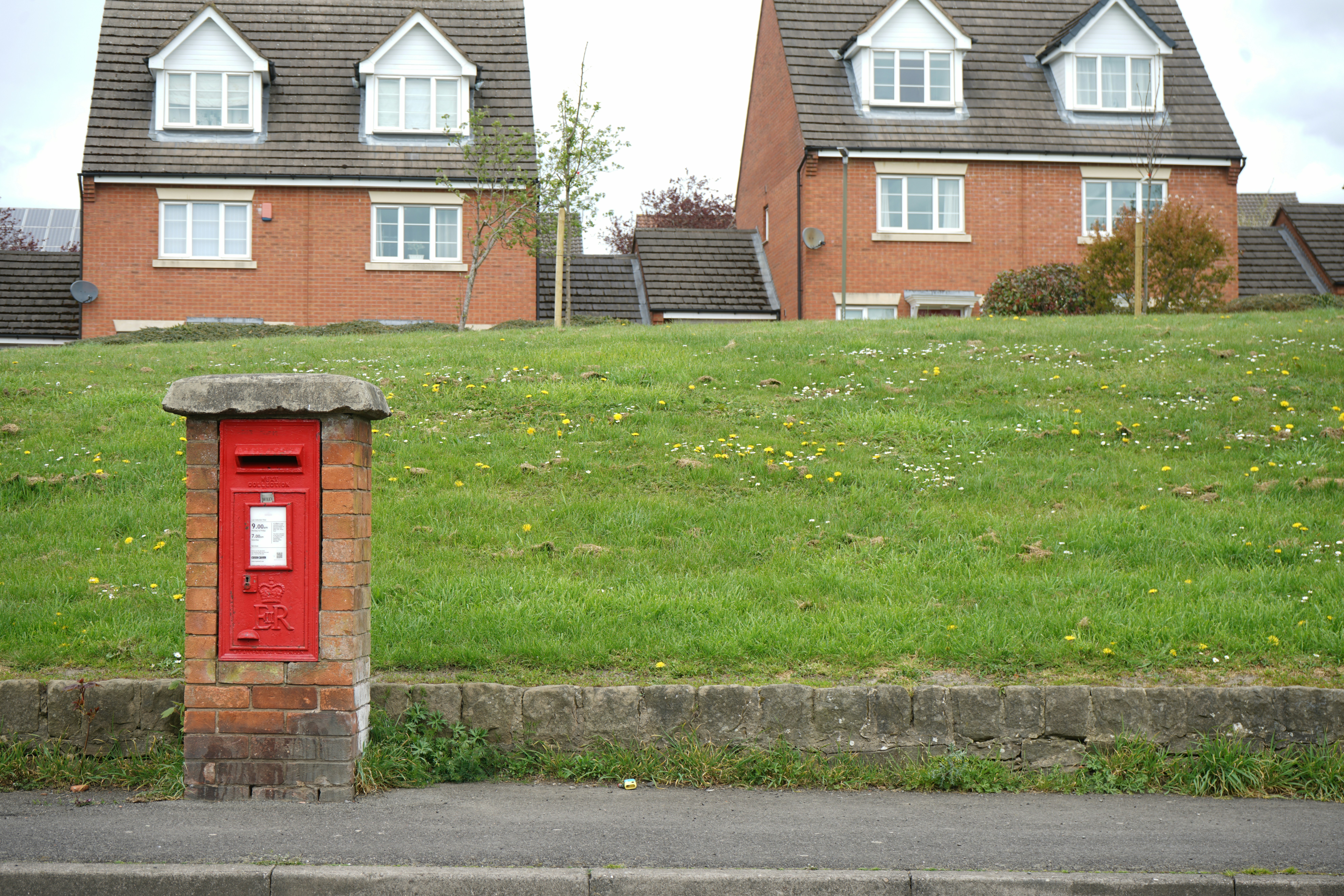 Red Mailbox in a Quiet Suburban Street