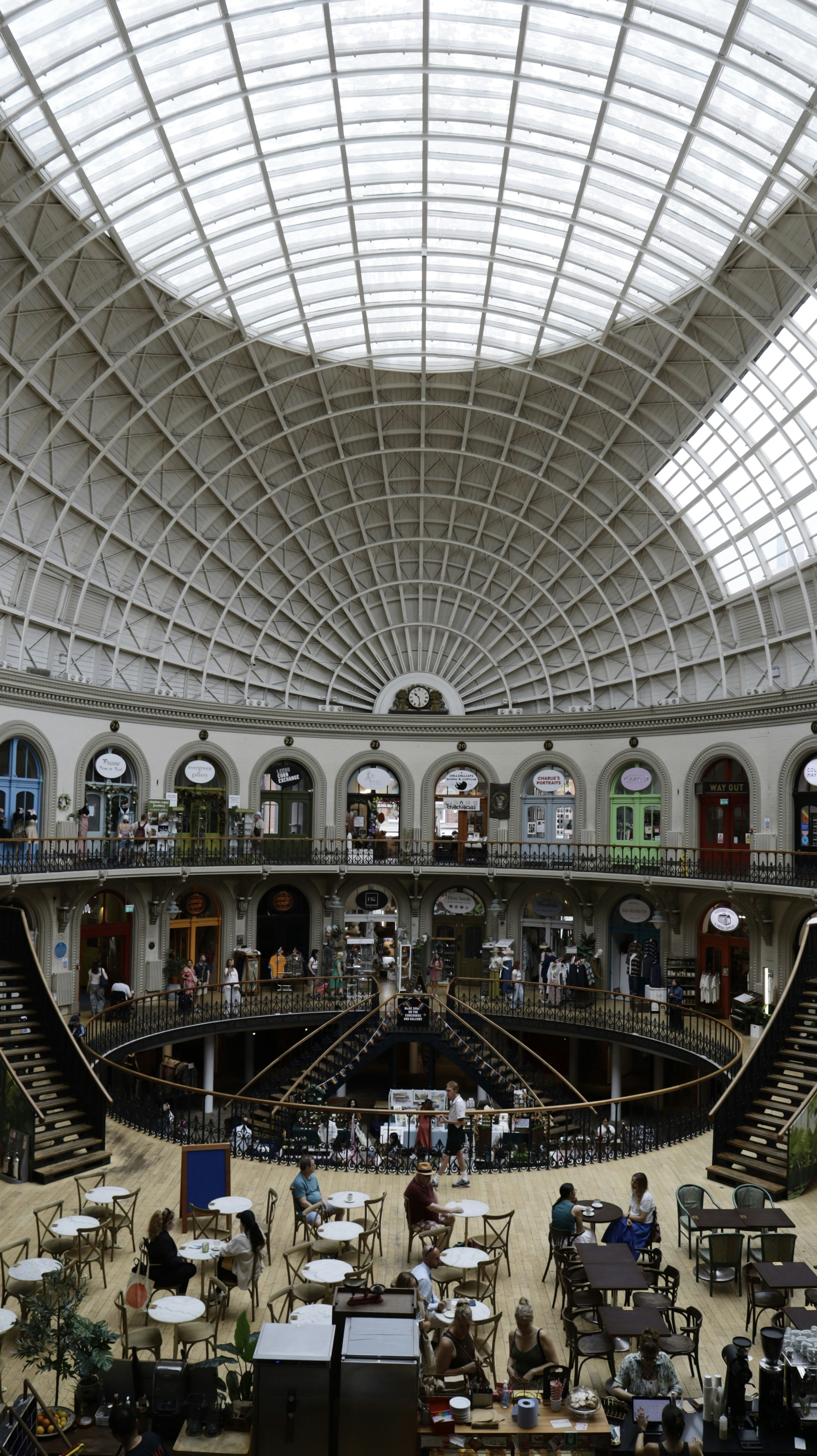 A Grand Glass Dome Over a Bustling Atrium Café