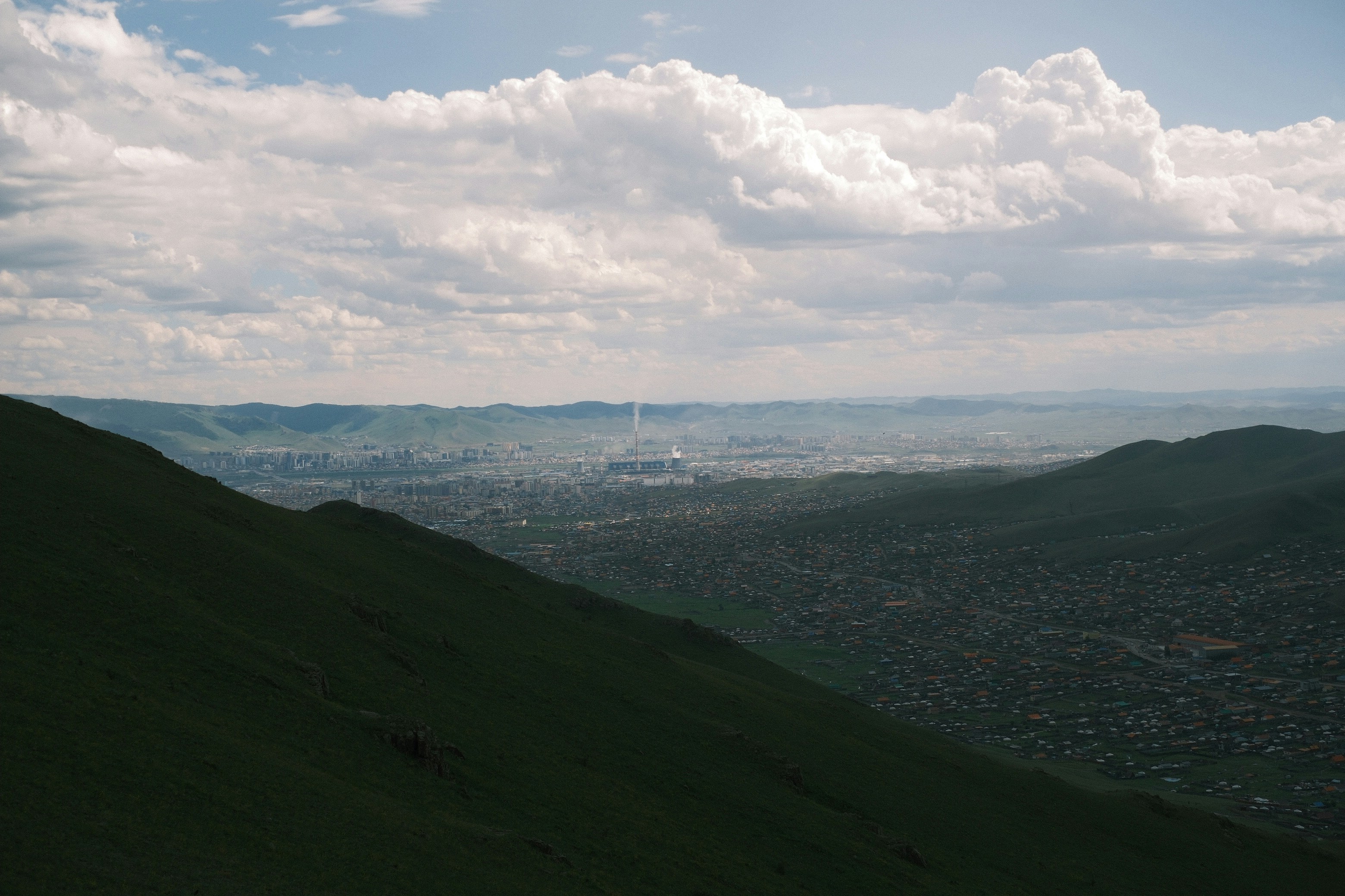 City Veil Beyond Green Slopes